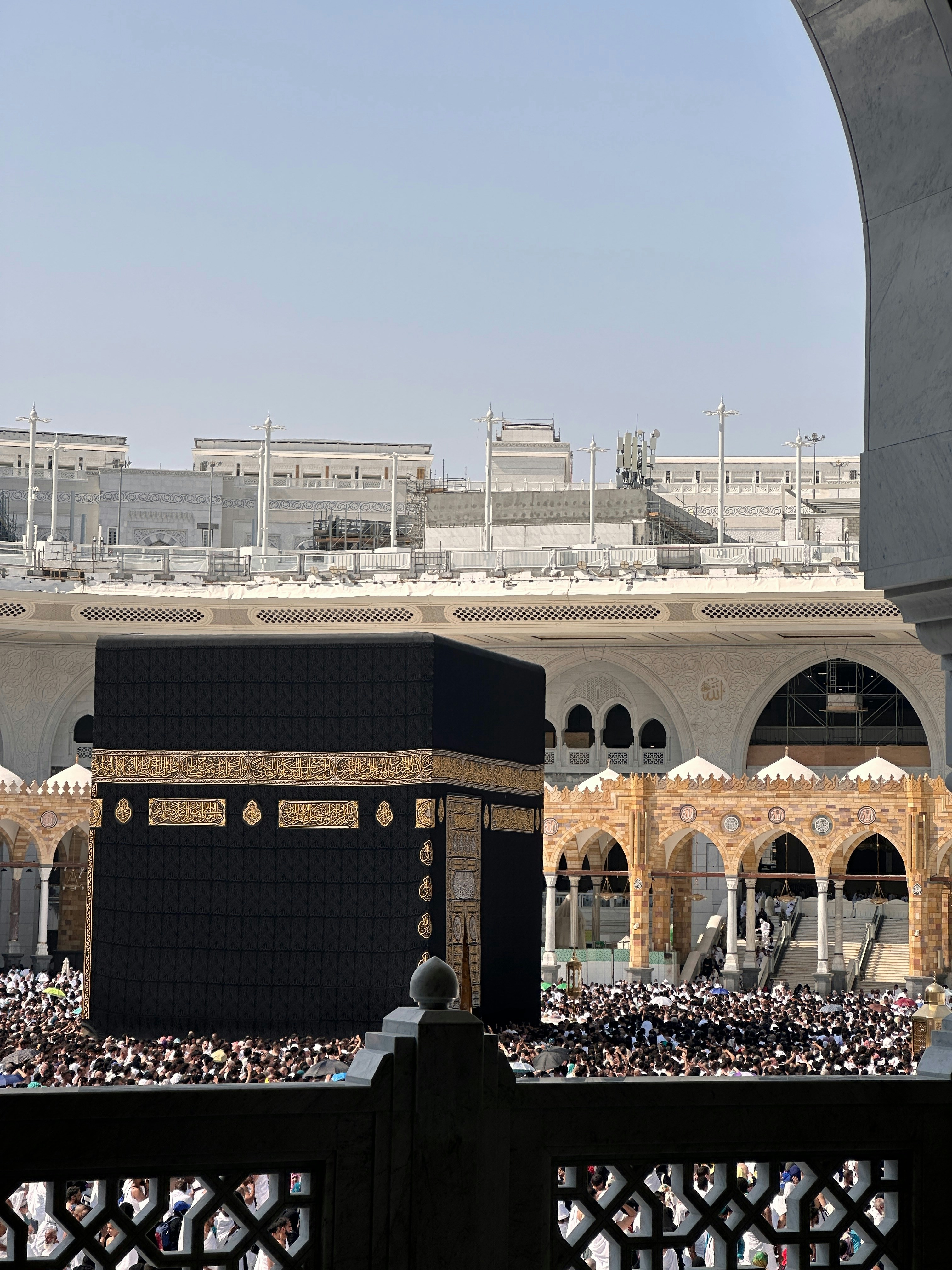 A crowd of people standing around a large building