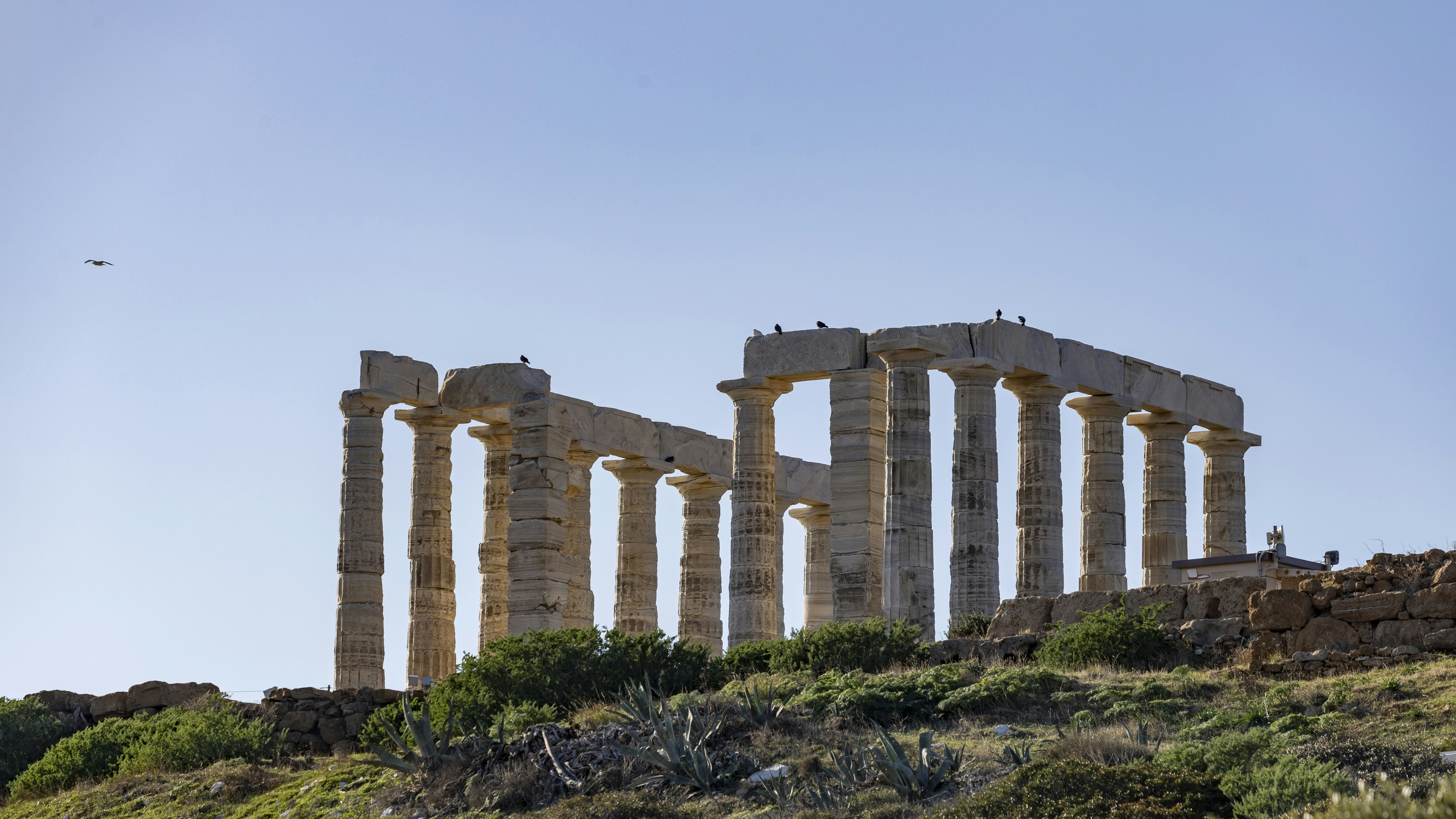 A large stone structure sitting on top of a hill photo – Free Temple of ...