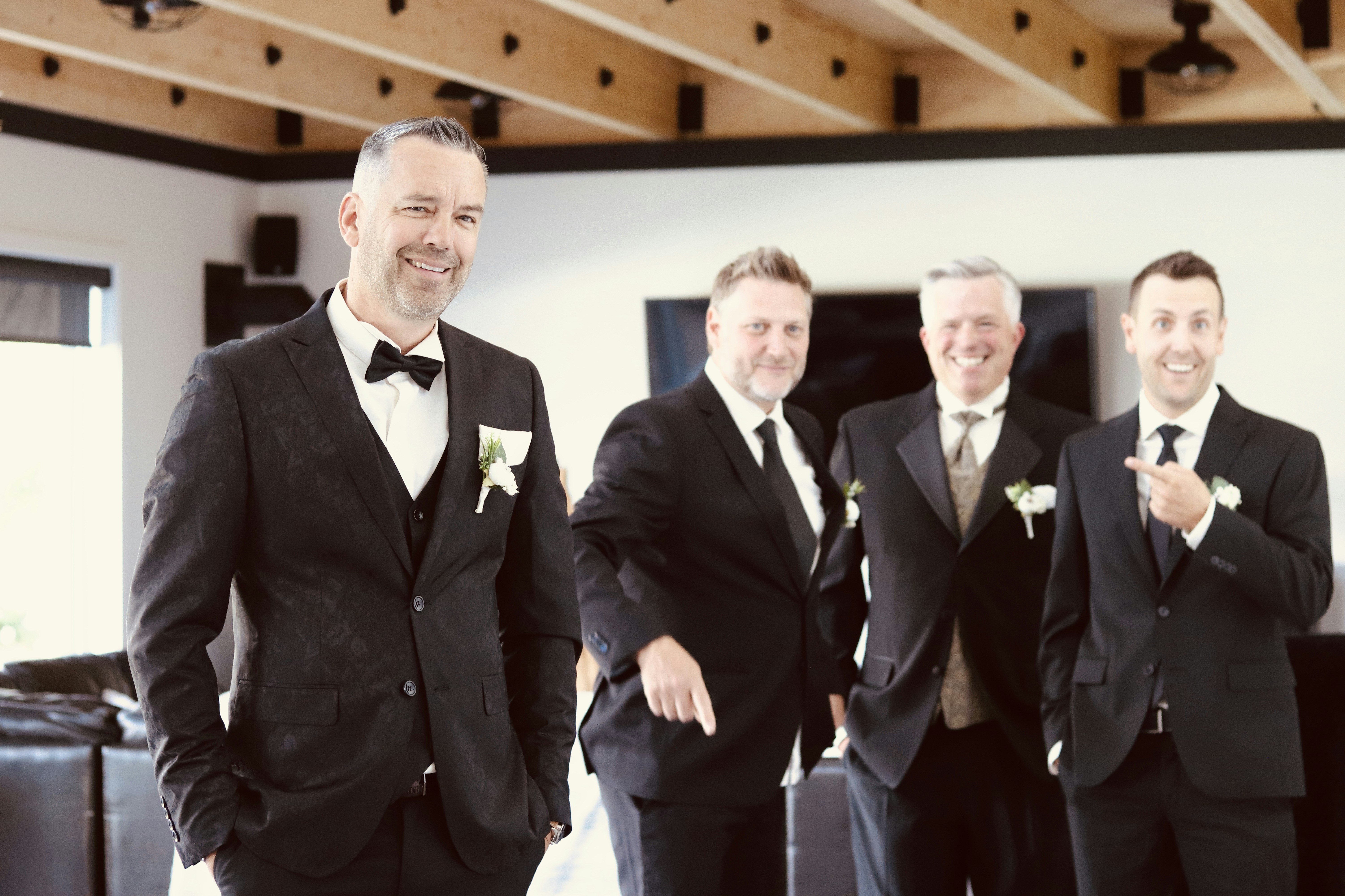 A group of men standing next to each other photo – Free Man Image on ...