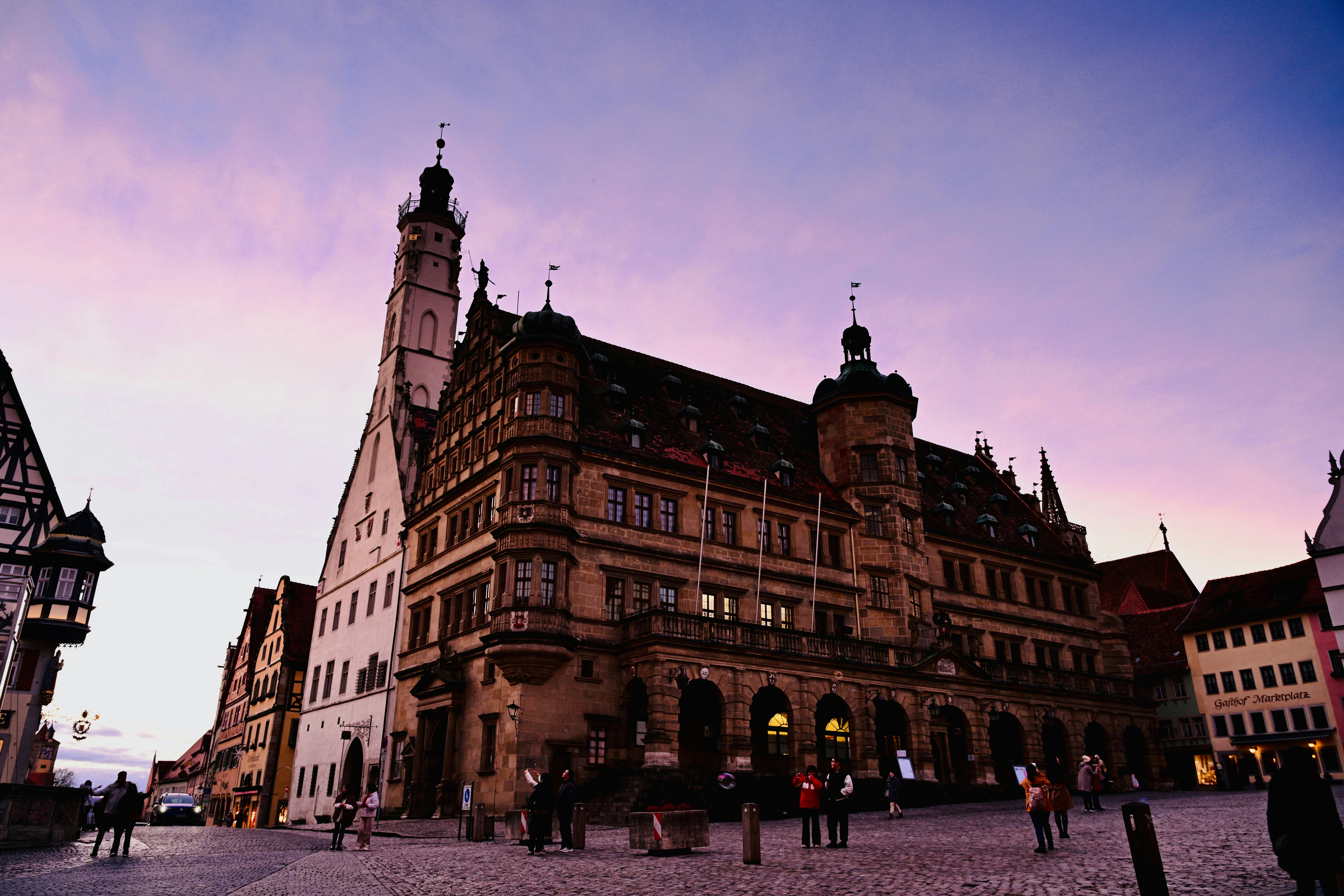 Dusk at the Rathaus: Violet hour over a cobbled town square