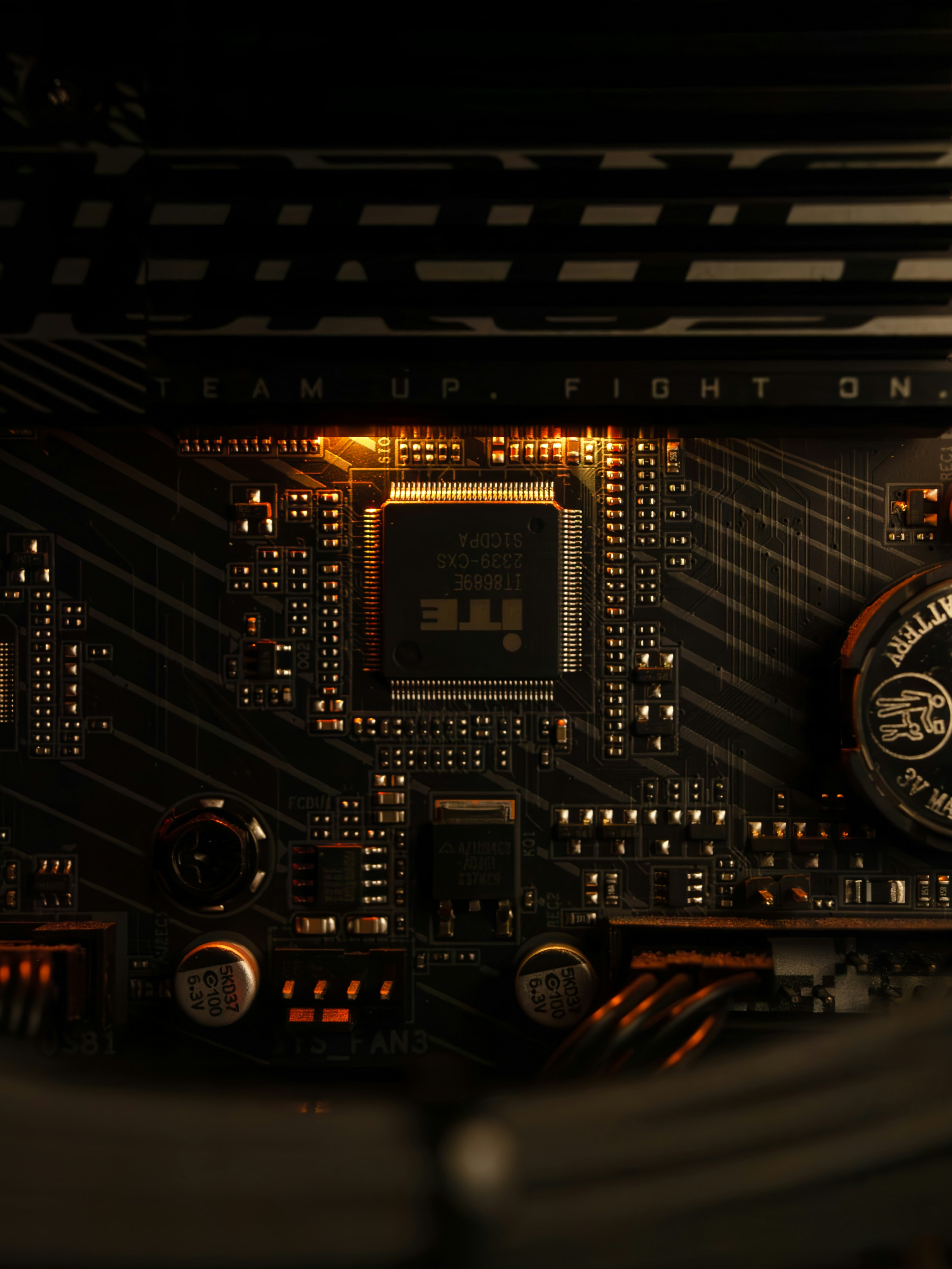 A close up of a computer motherboard with a clock photo – Free Computer ...