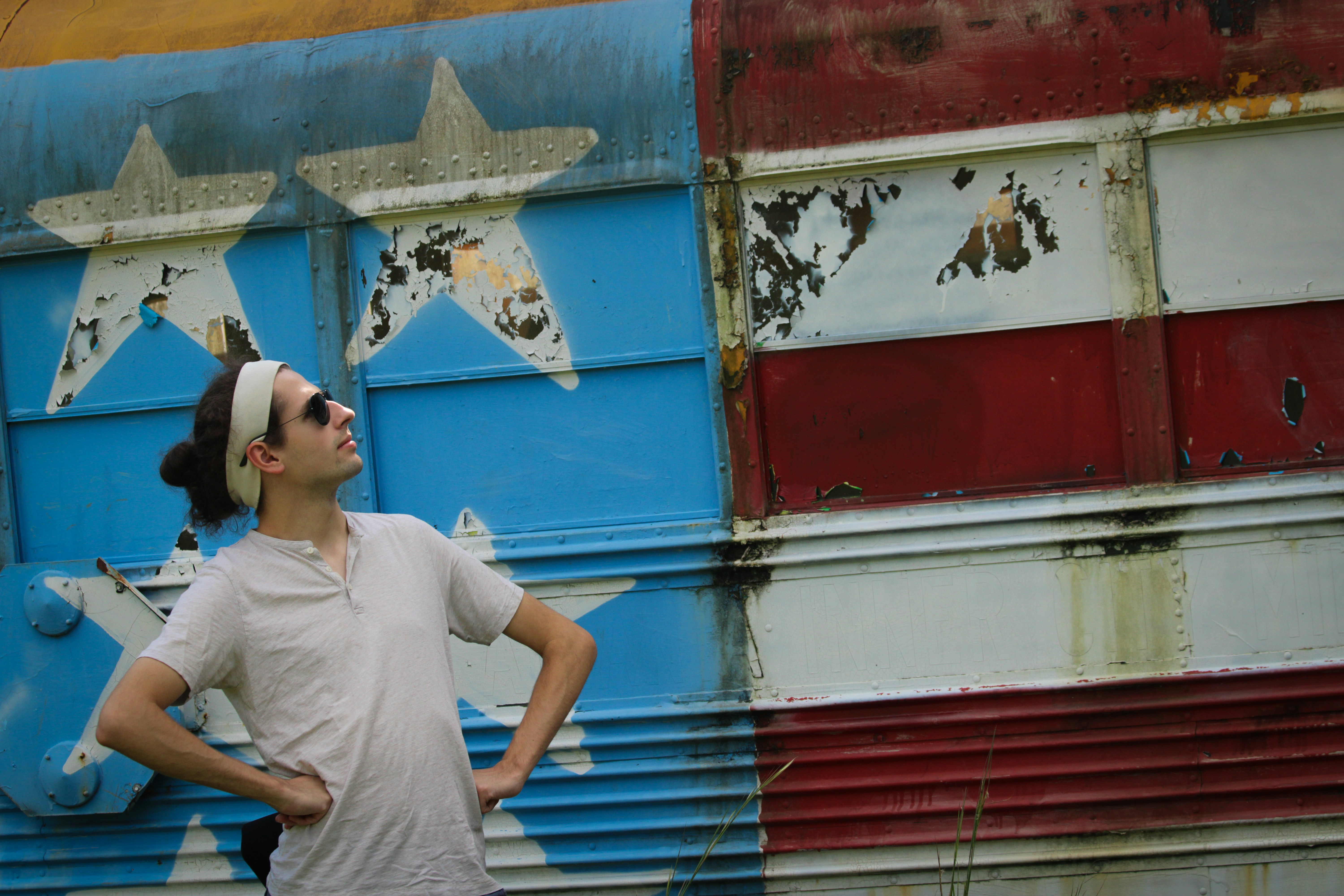 Stance Before a Weathered Star-Spangled Wall