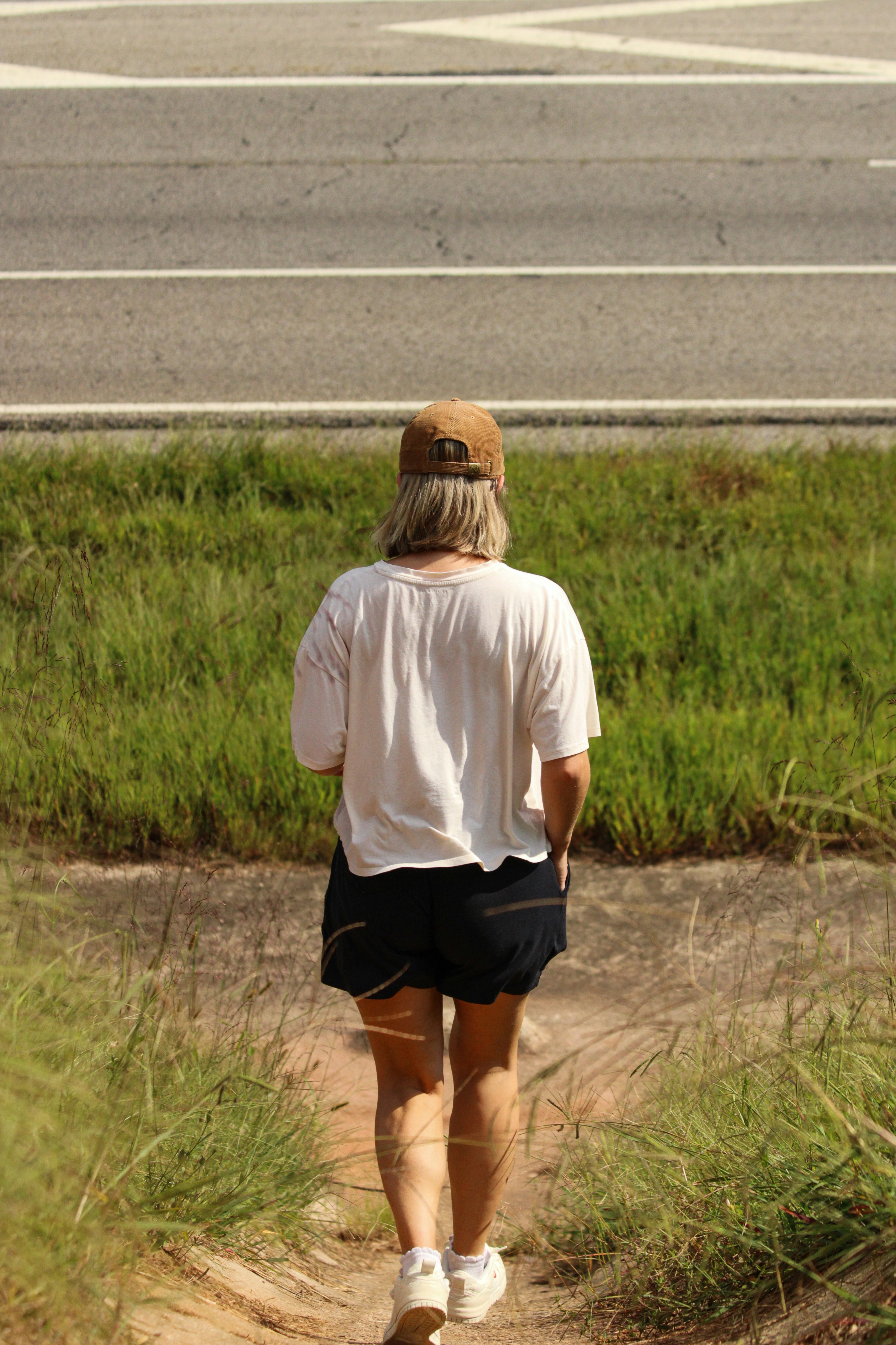 Footpath Echoes: A Lone Walker Beyond the Verge