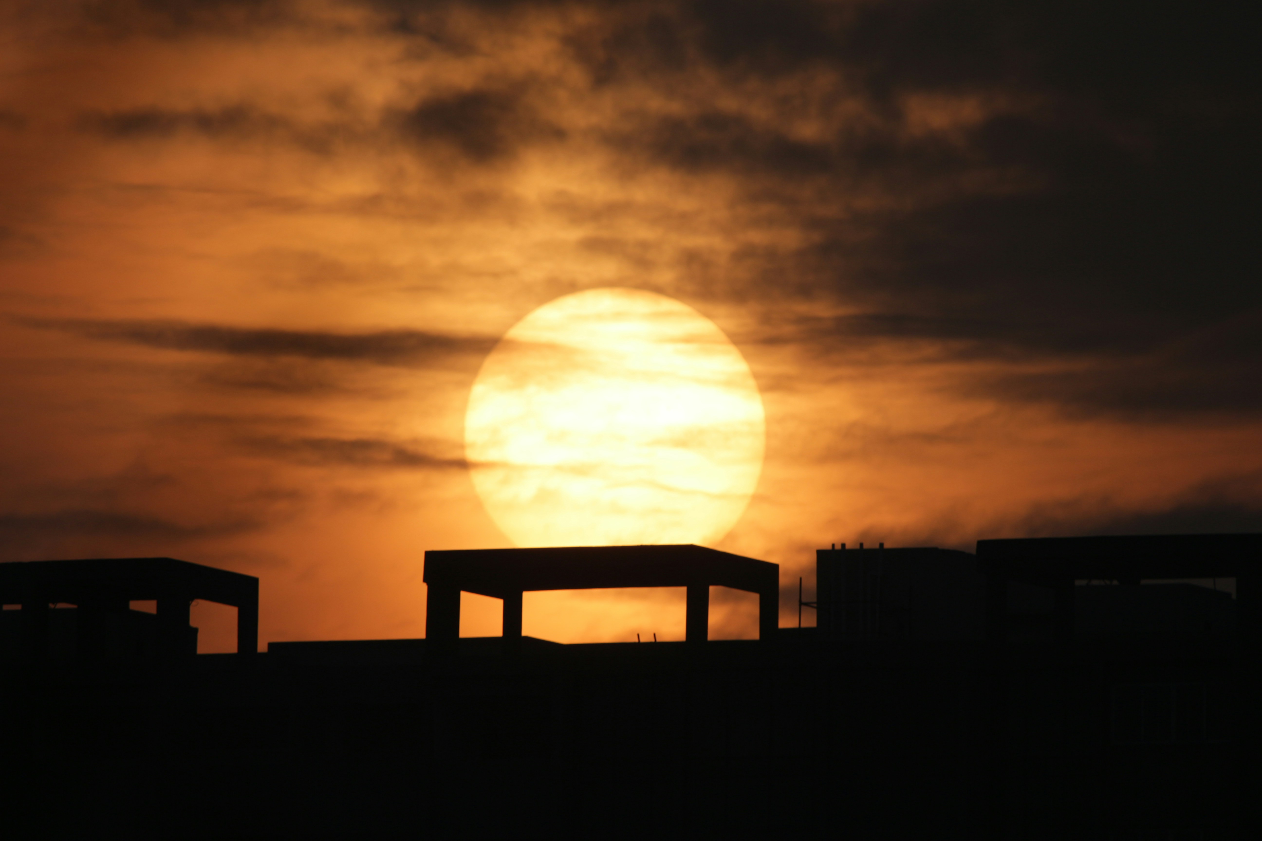 The sun is setting over a city skyline photo – Free Sunset Image on ...