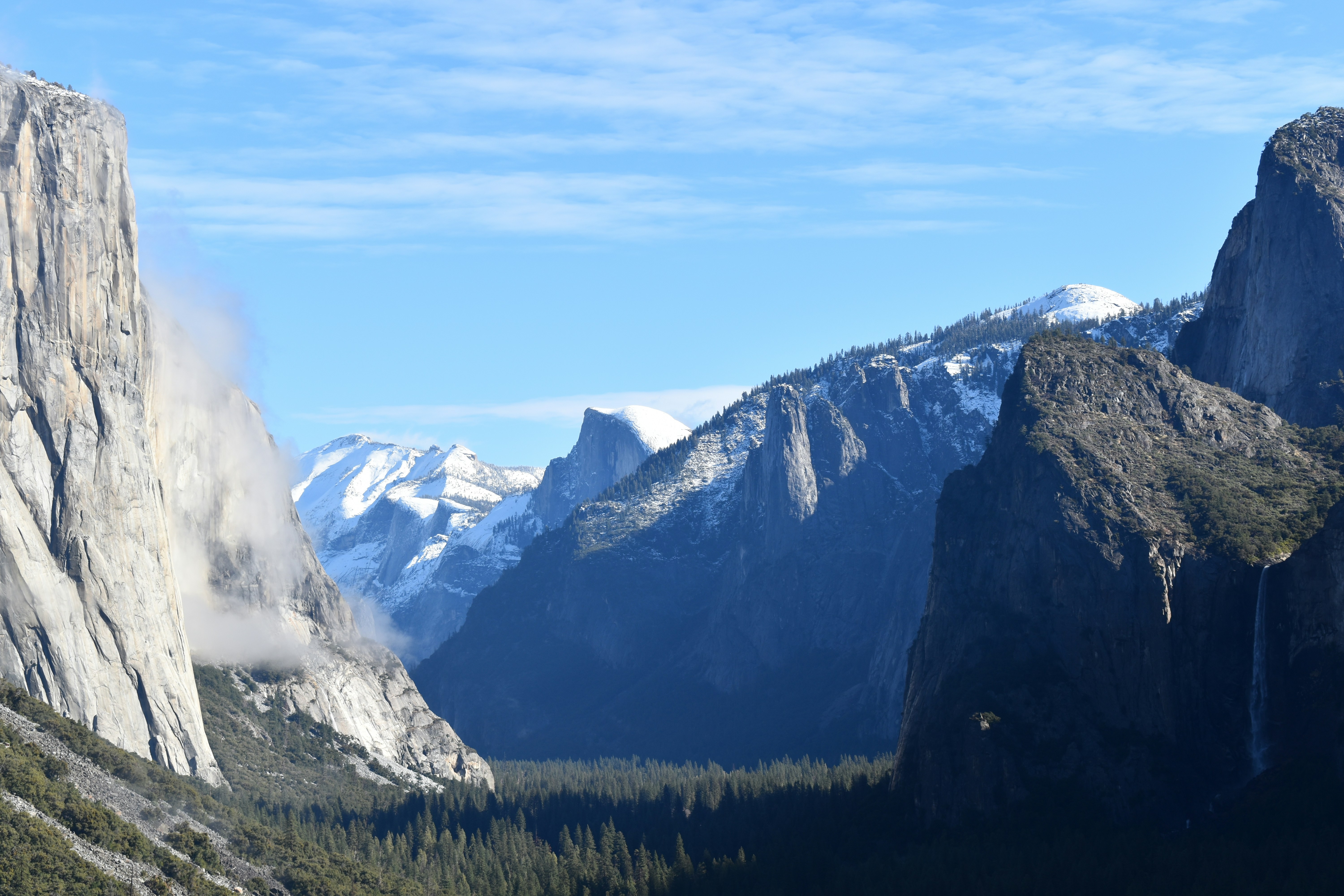 A view of a valley with mountains in the background photo – Free ...