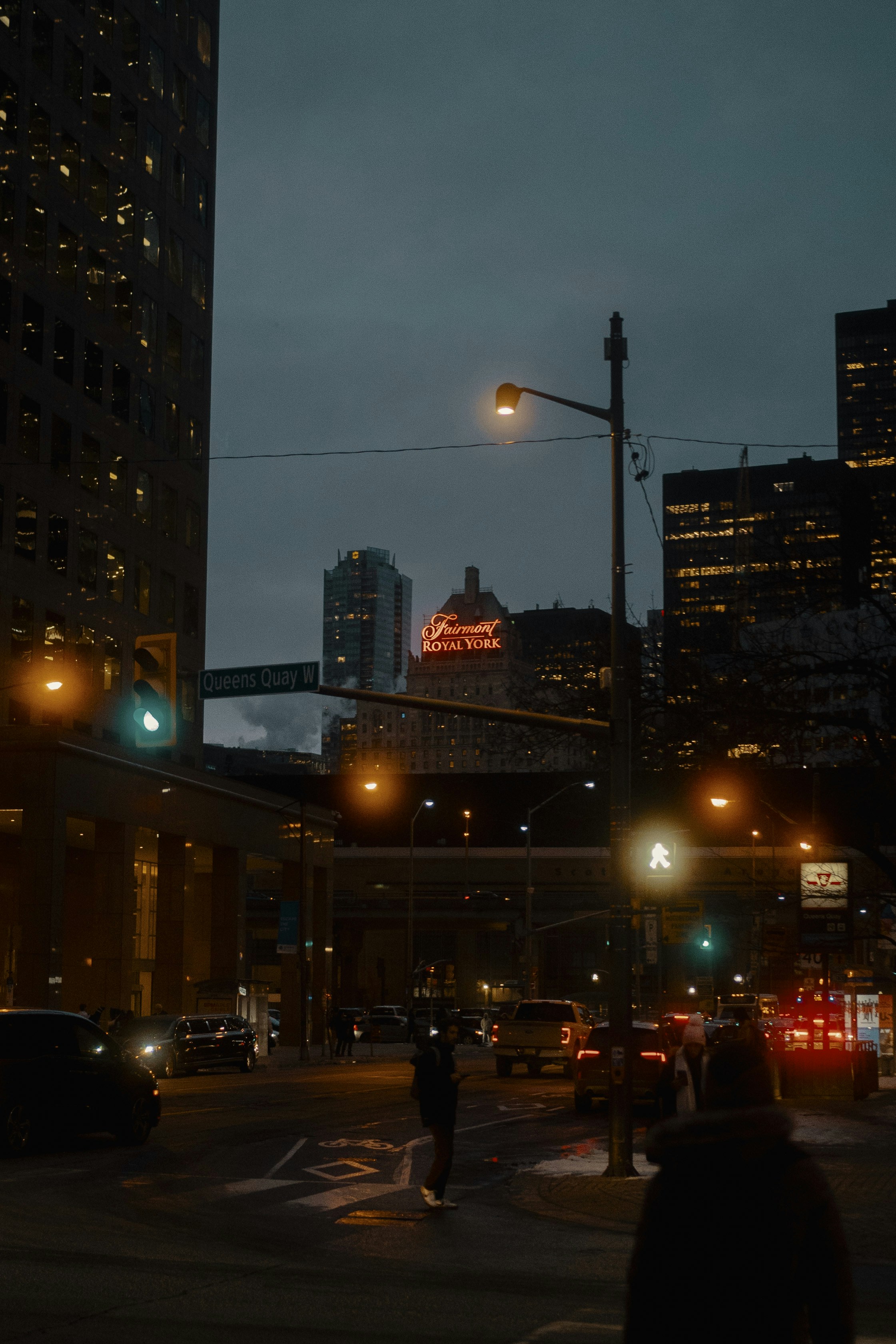 A city street at night with traffic lights photo – Free Street ...