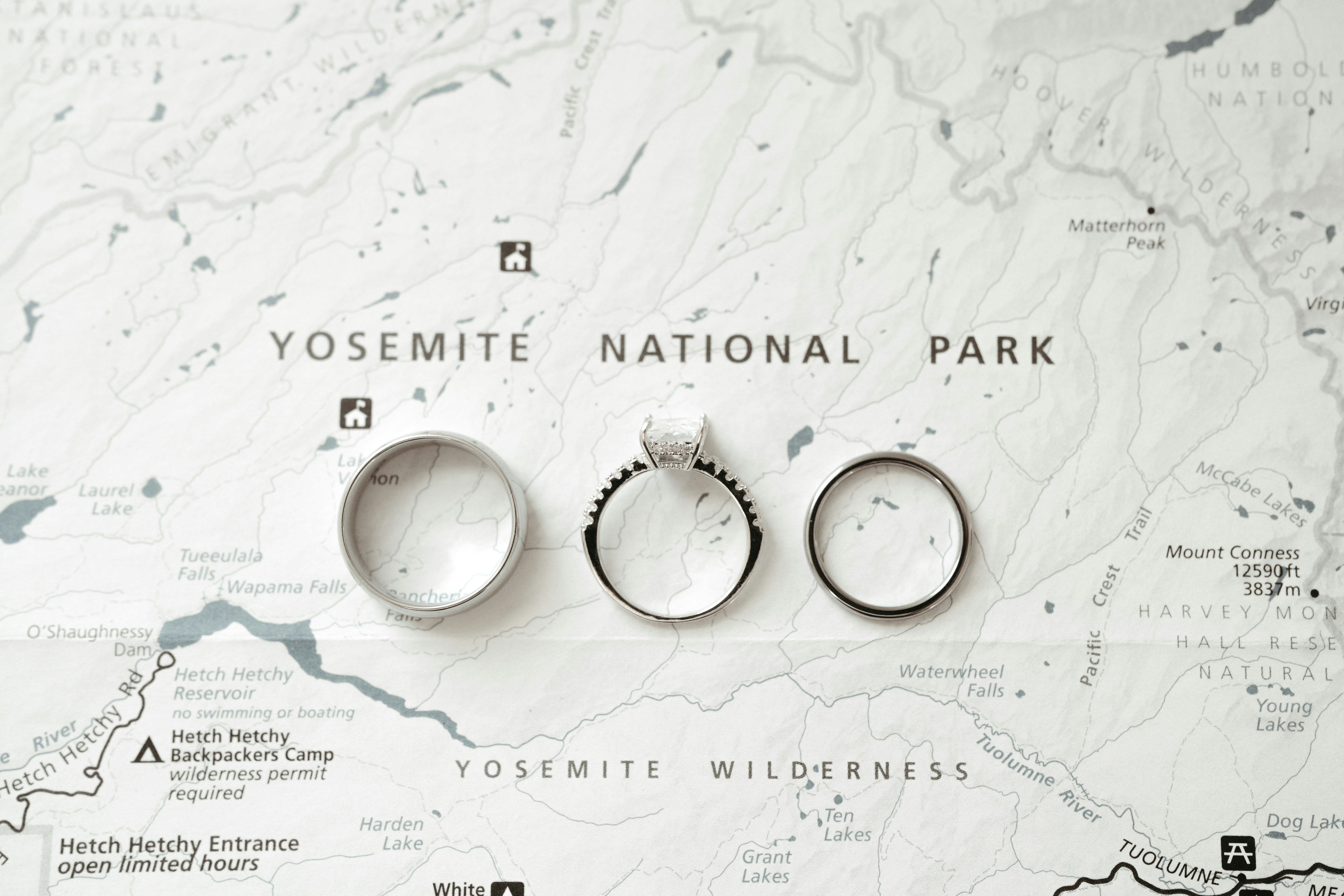 A map with three rings on top of it photo – Free Jewelry Image on Unsplash