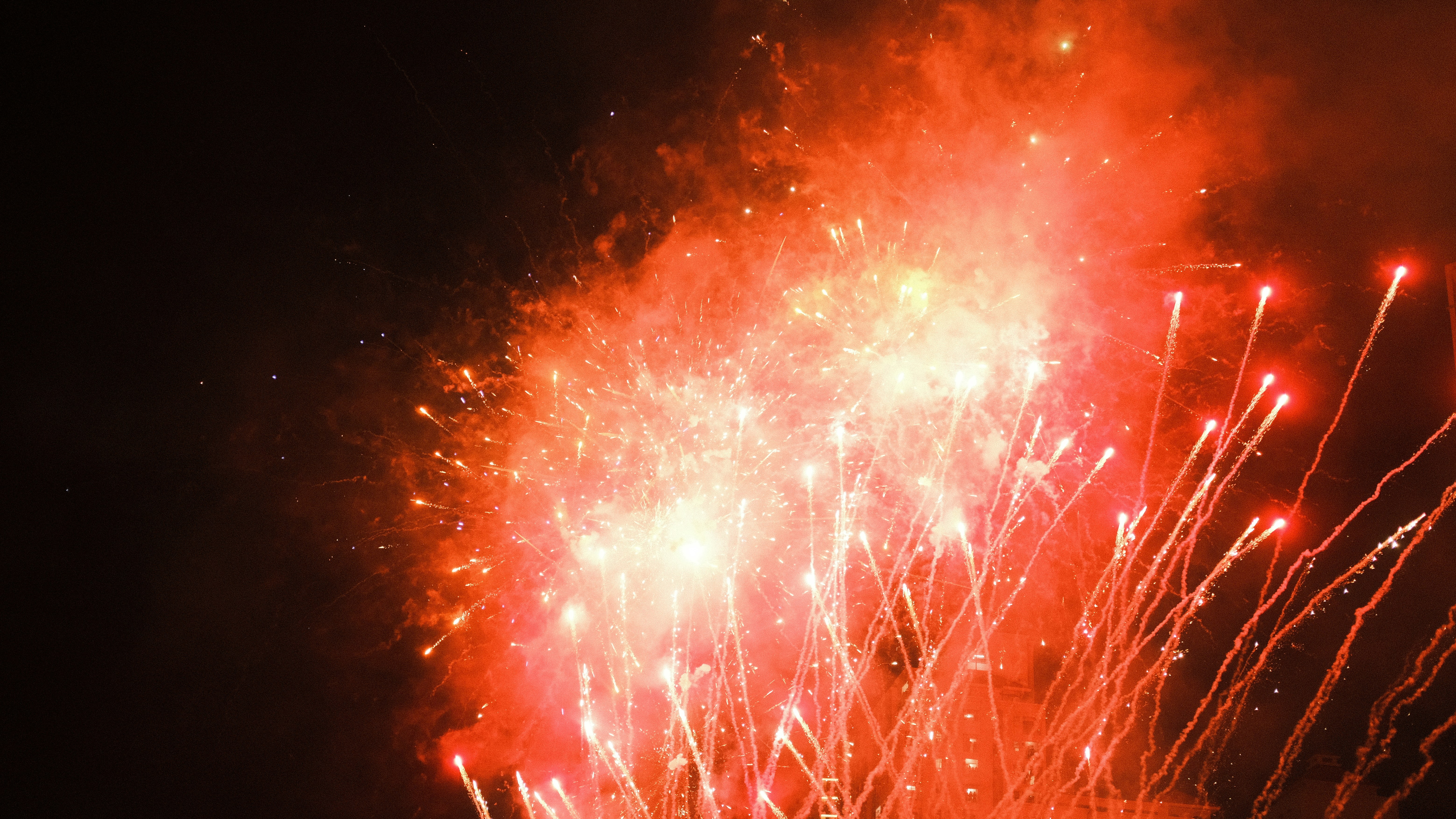 A firework display in the night sky photo – Free Jakarta Image on Unsplash