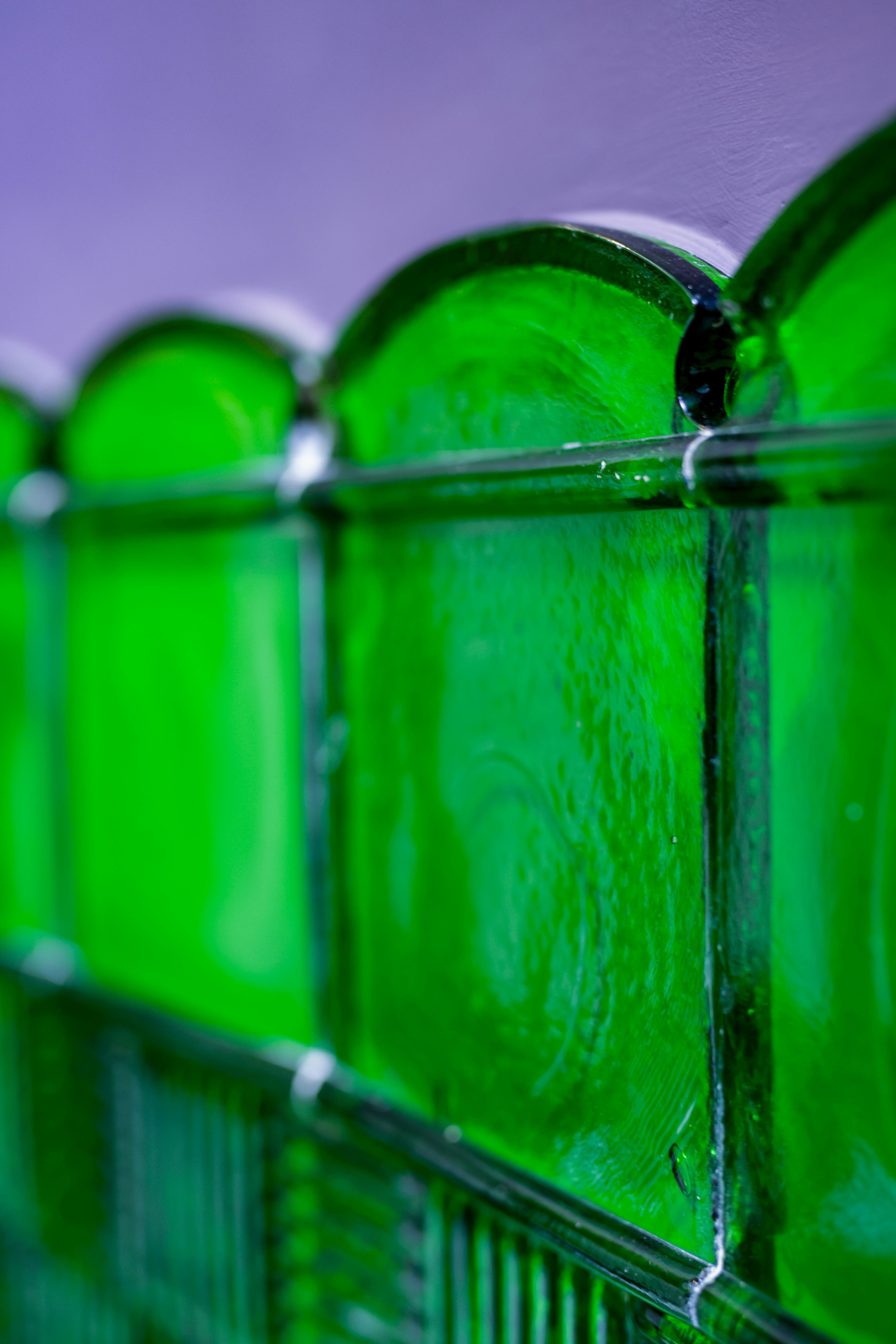 Emerald Glass: A Macro Study of Curved Green Tiles
