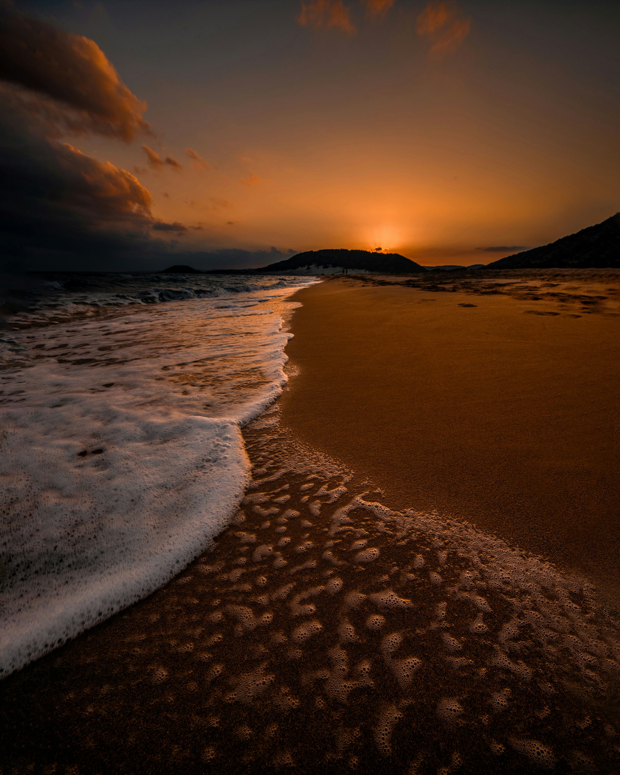 A sunset over a beach with waves coming in photo – Free Dipkarpaz Image ...