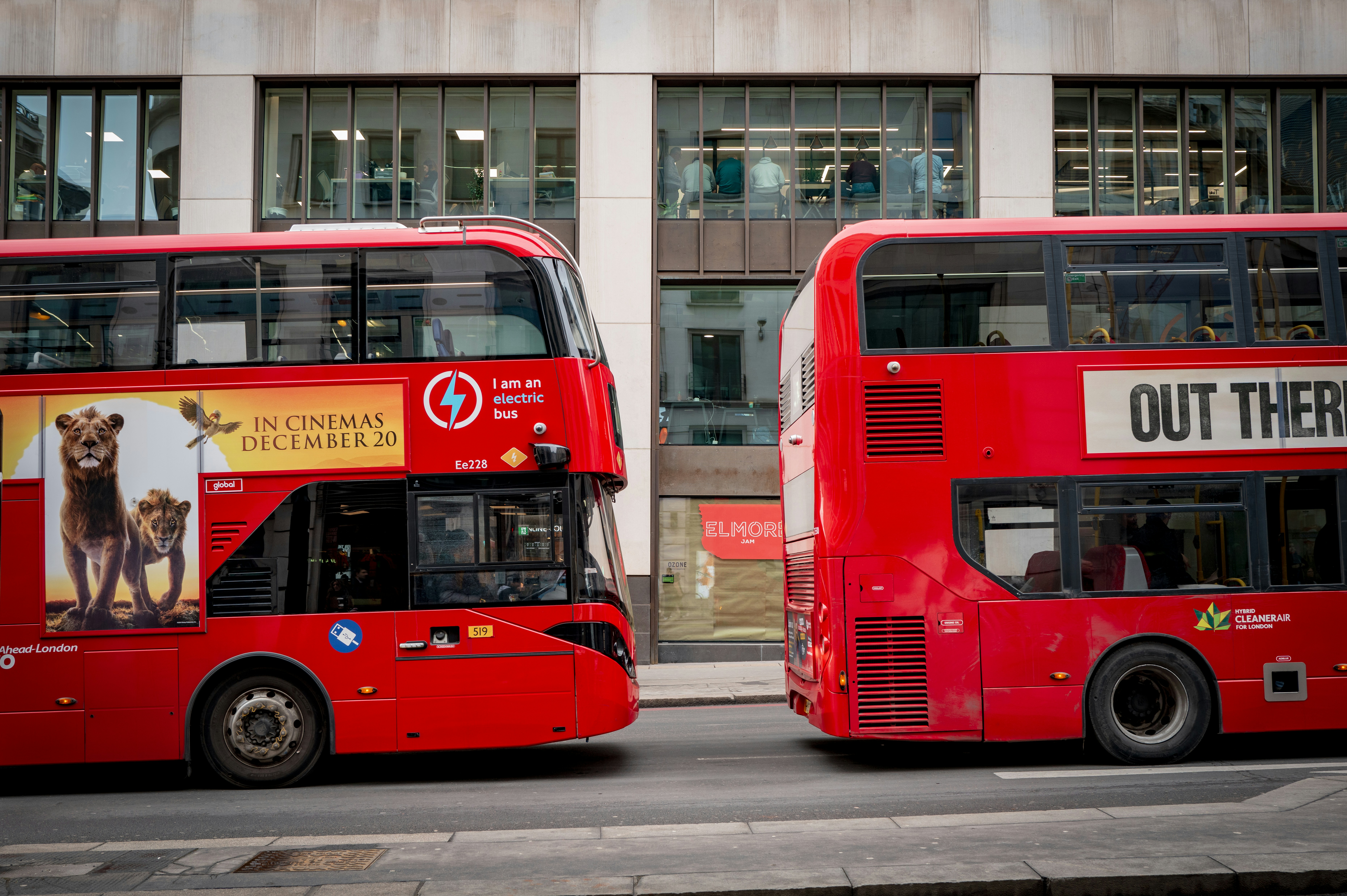 Two red double decker buses parked next to each other photo – Free Car ...