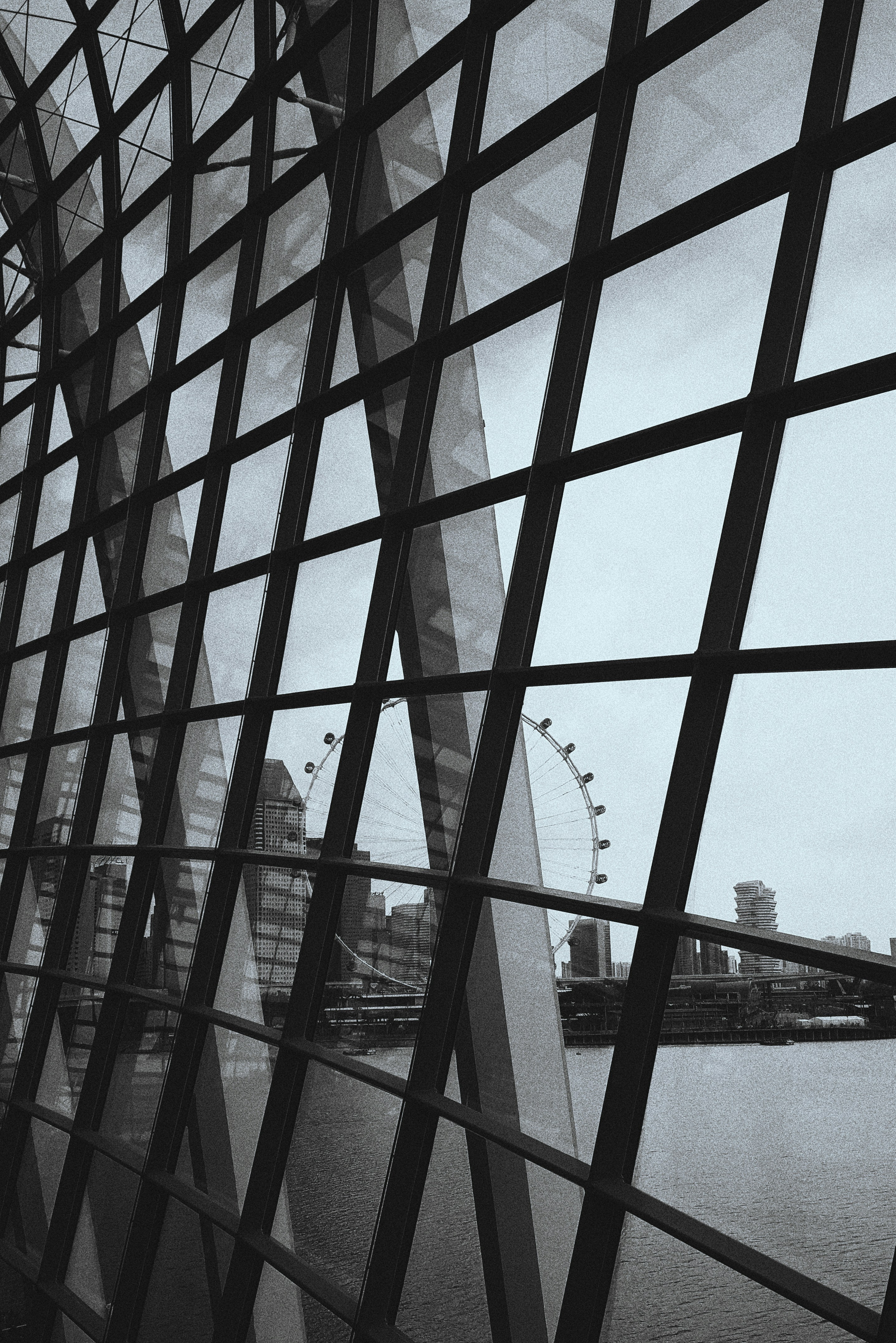 Grid and River: A Glassy Cityscape Through Diagonal Frames