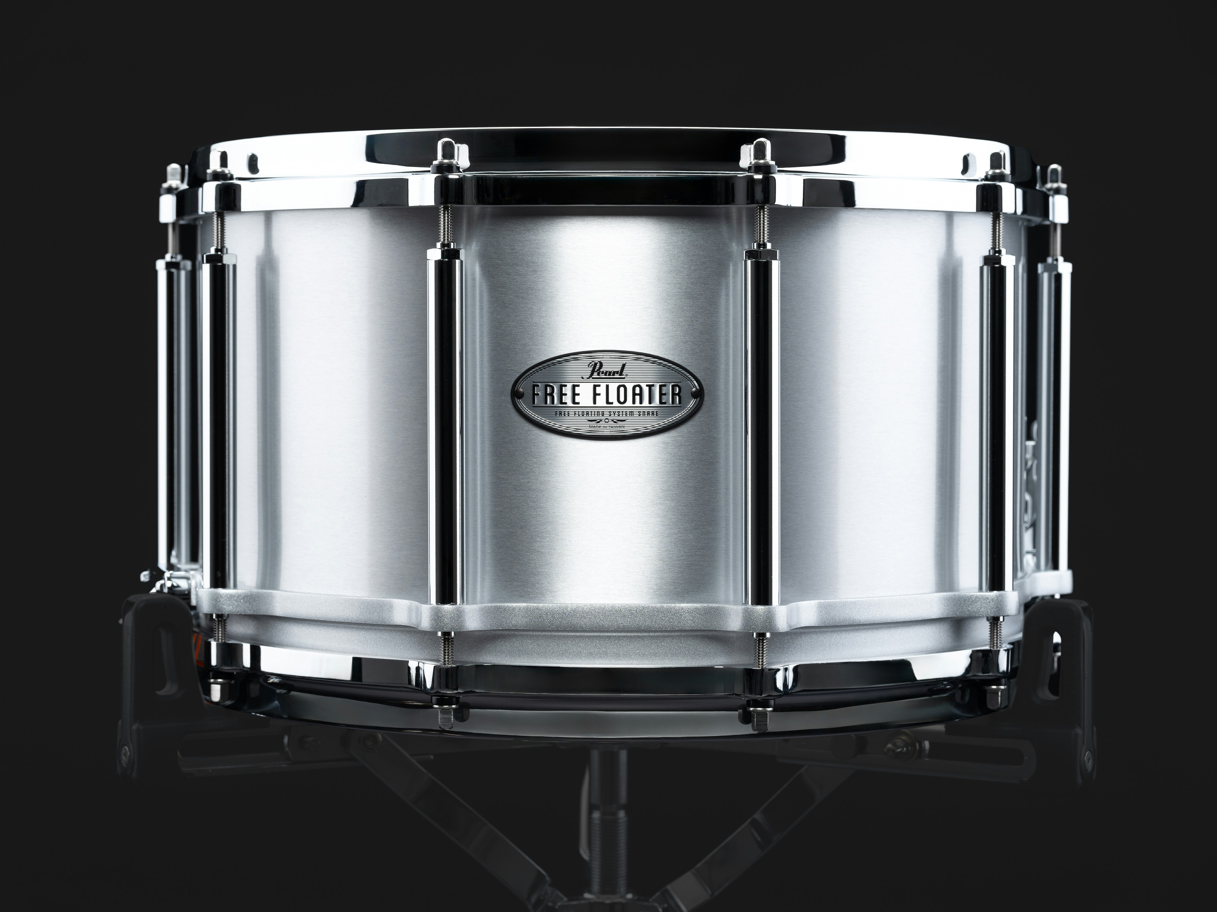 A silver drum on a black background photo – Free Snare drum Image on ...