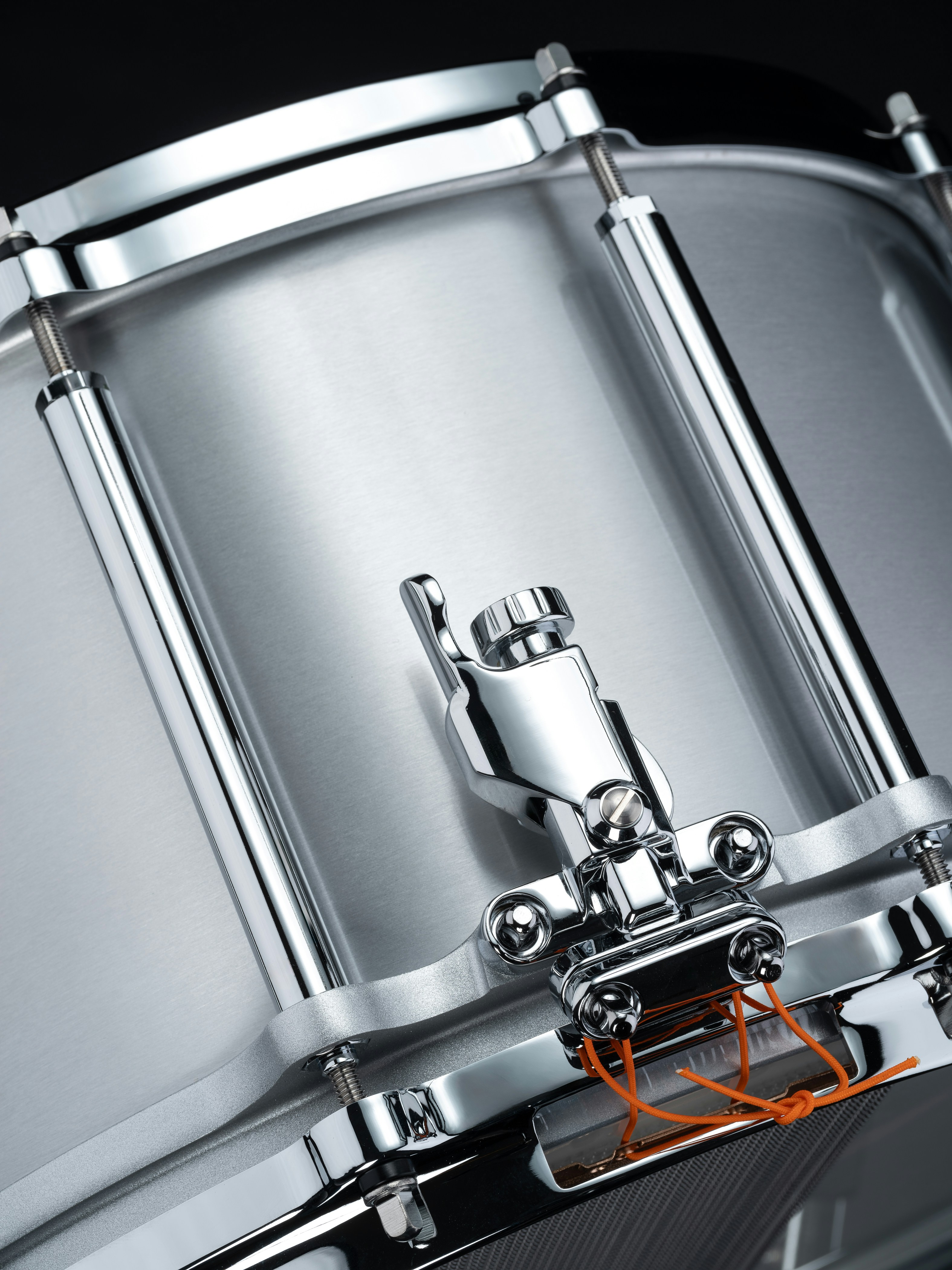 A close up of a silver drum on a black background photo – Free Snare ...