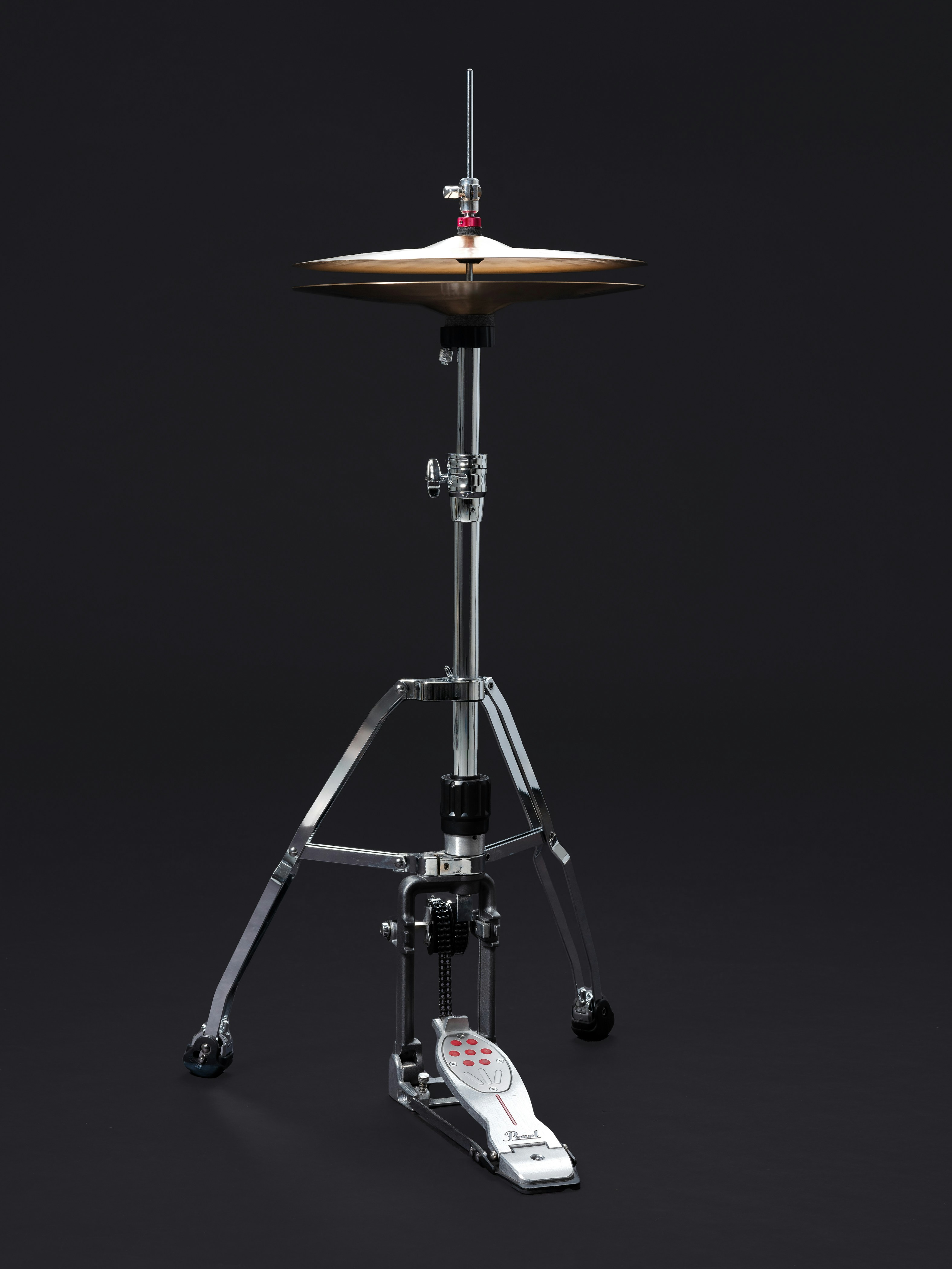The Silent Ride: A Drum Pedal Suspended in a Studio Solitude
