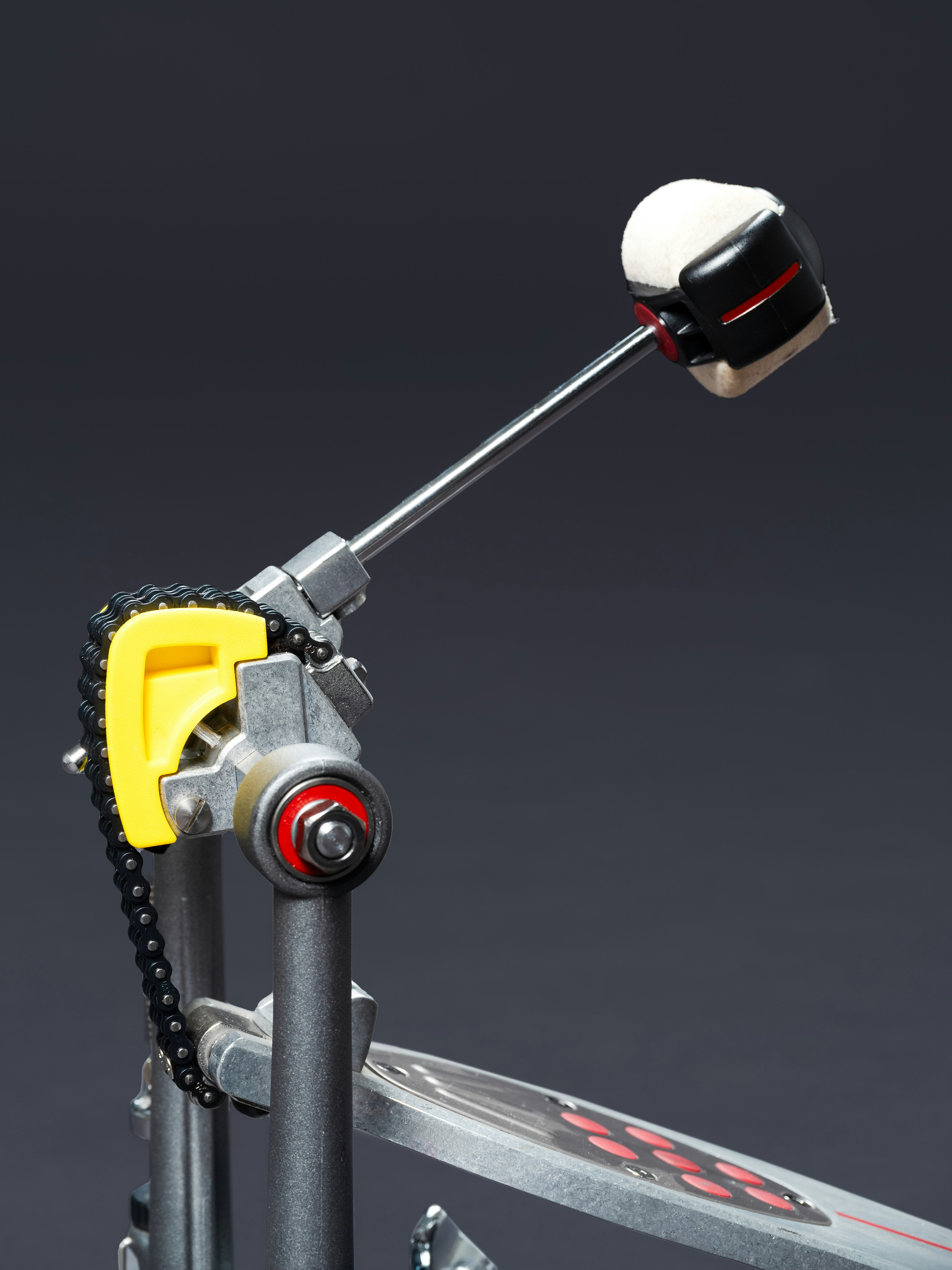 Precision Tilt Arm: Close-up on a compact studio rig's chain-driven joint.