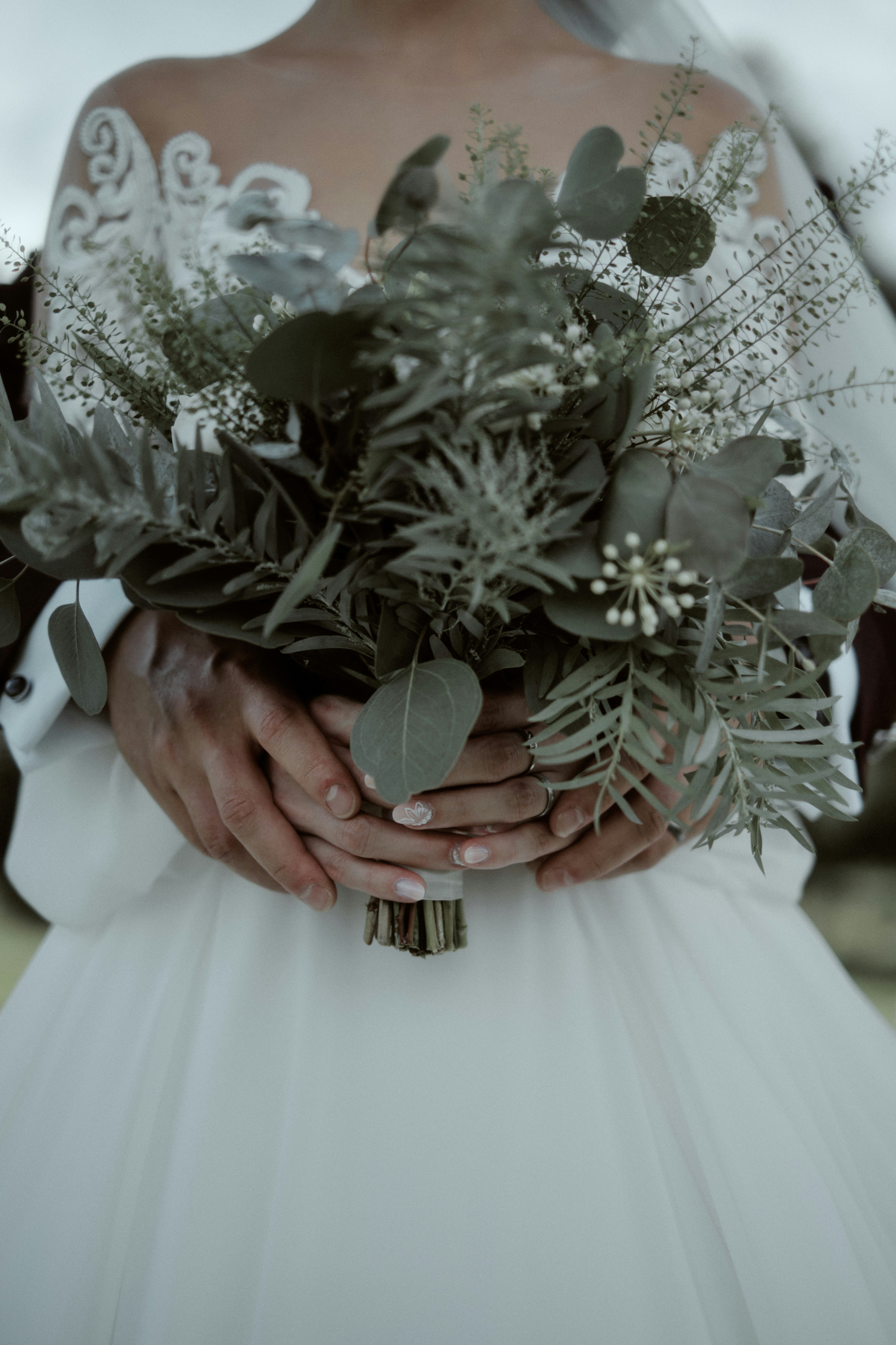 Eucalyptus and Delicate Sprigs: a Bride's Bouquet Framed in White