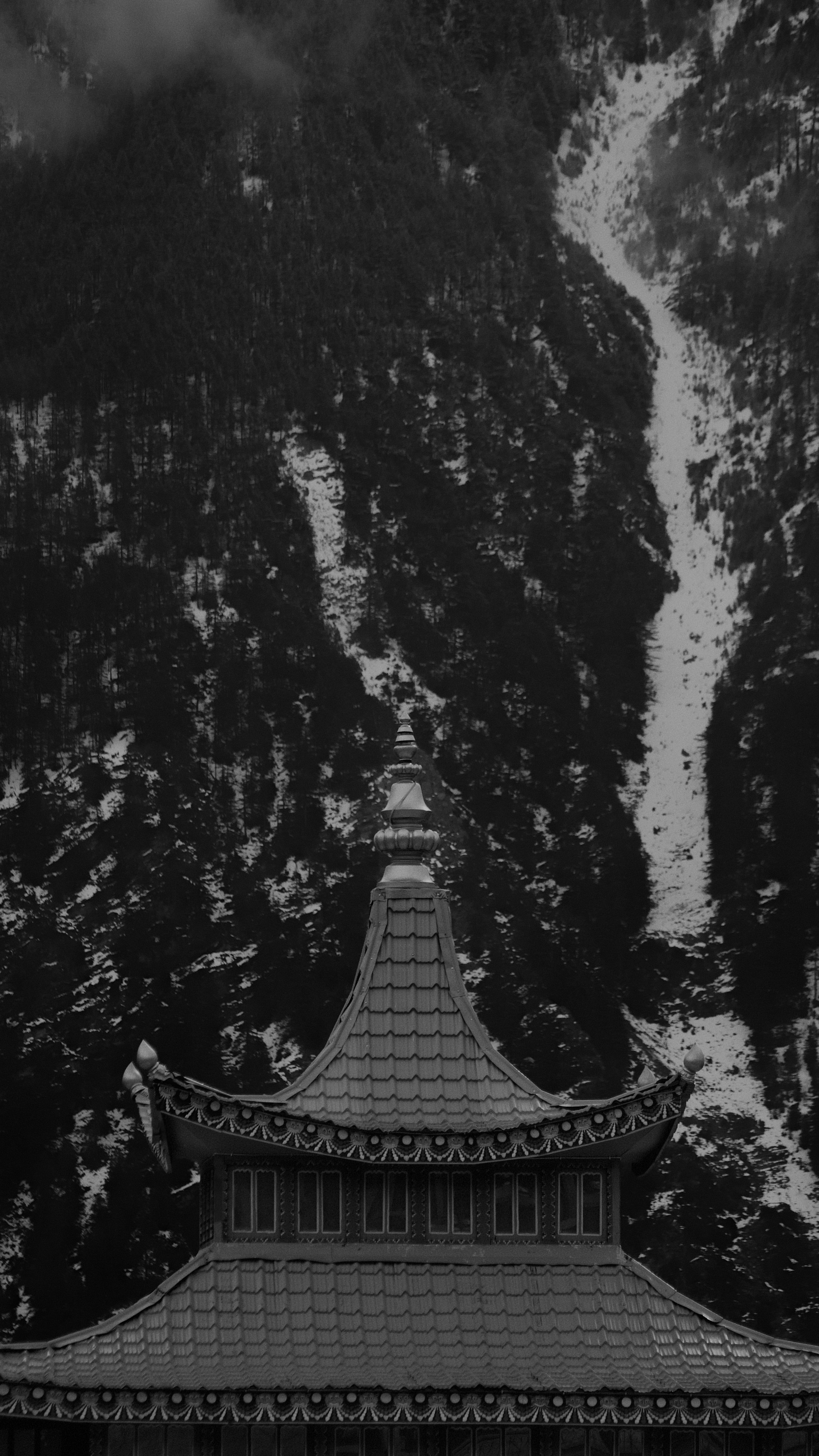 Snowbound Spire: A Silent Pagoda Emerges from the Mountain's Veil