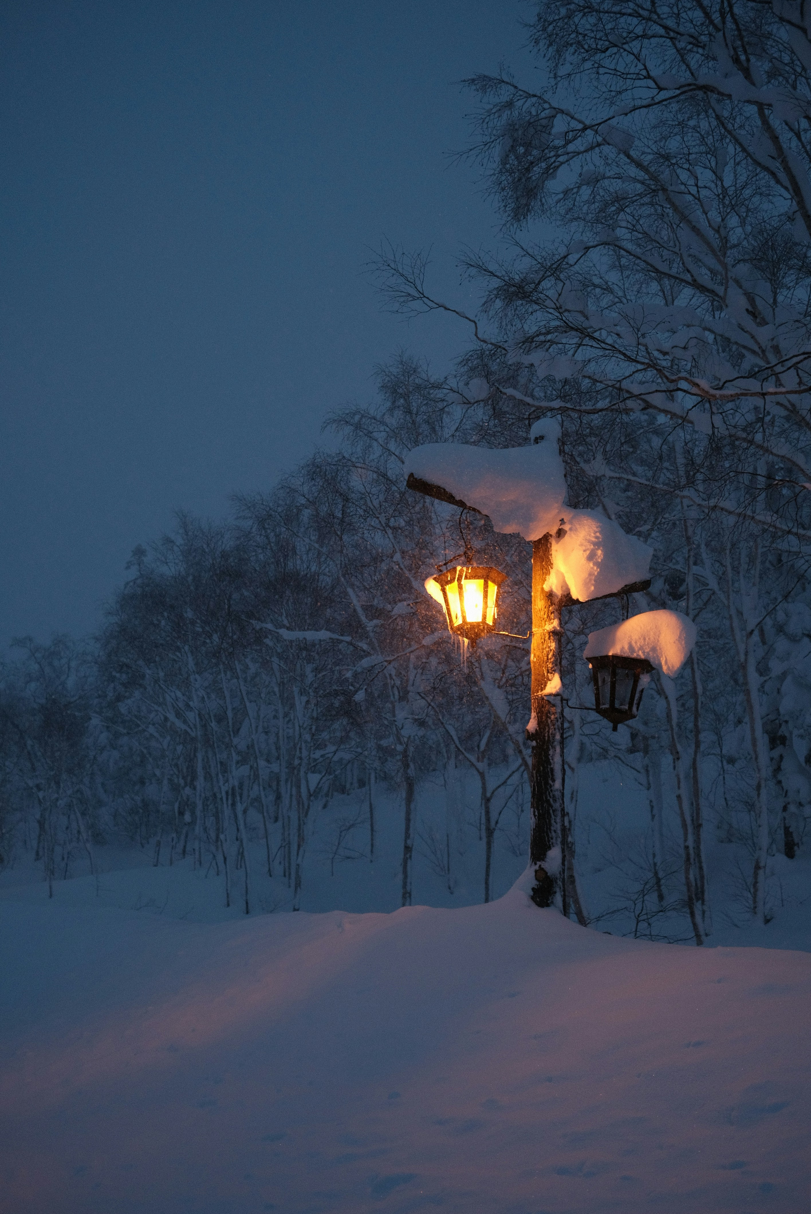 Amber Lantern in a Blue Hour Snowscape