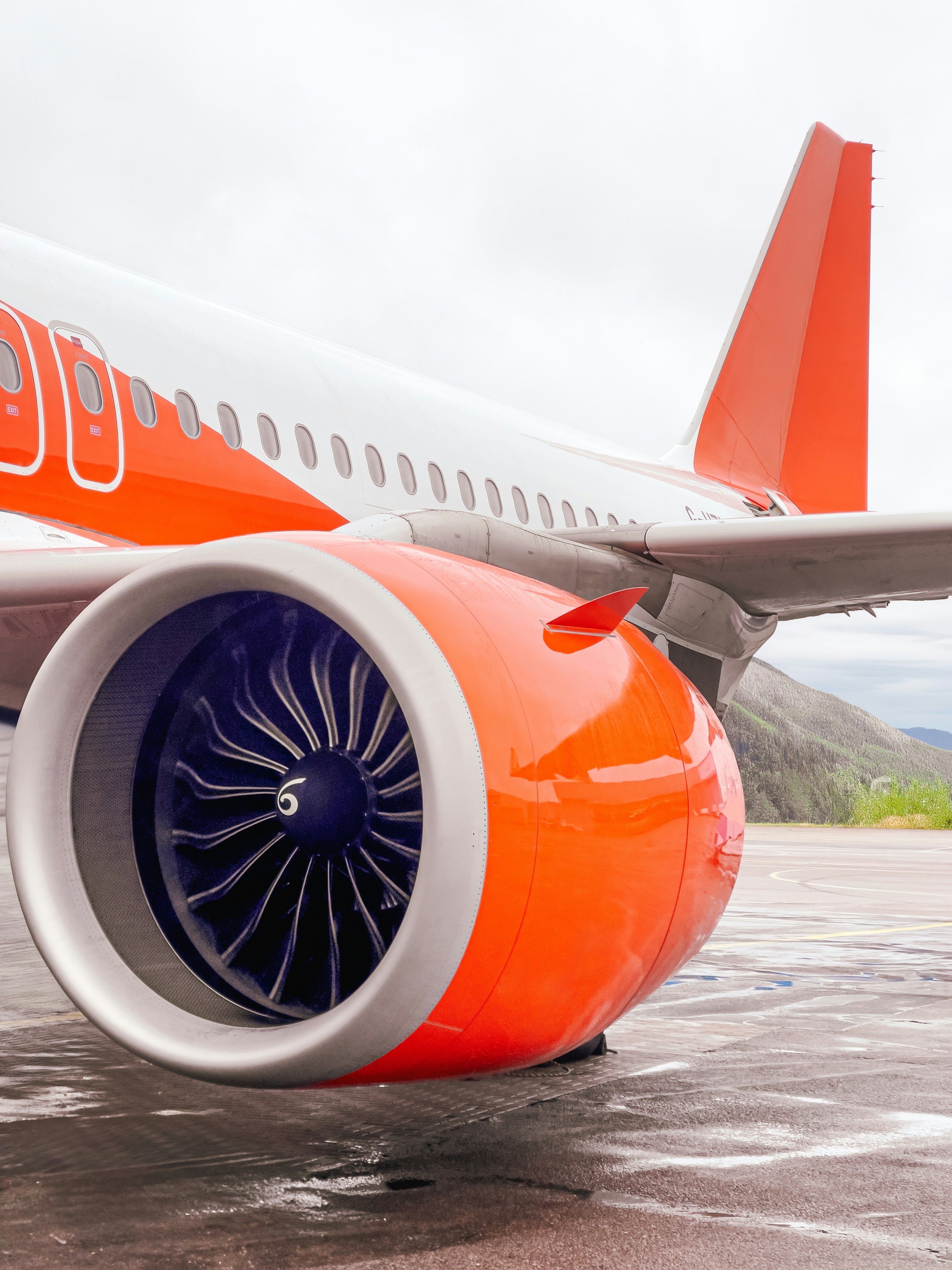 A large jetliner sitting on top of an airport tarmac photo – Free ...