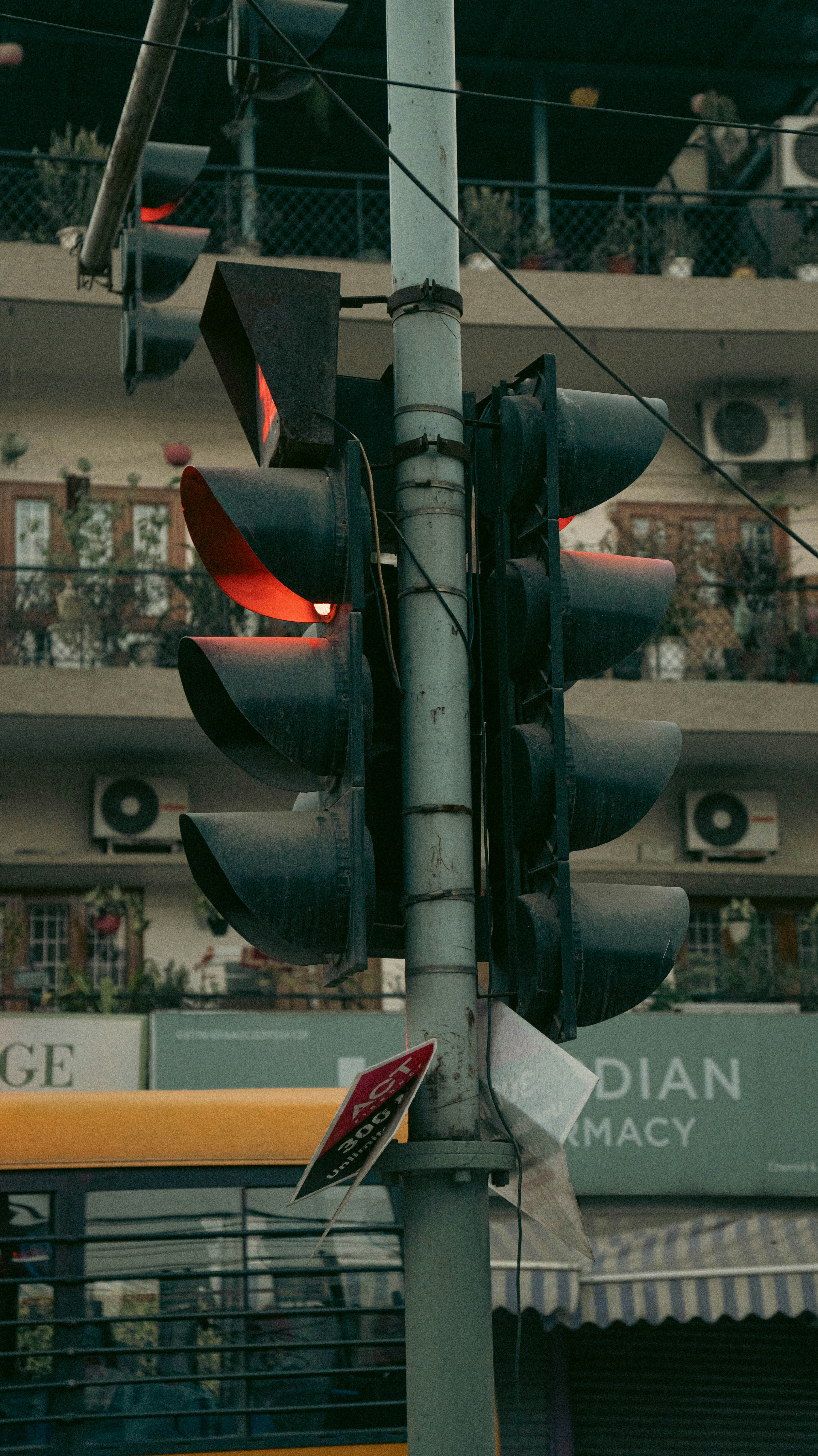 Red Signal at a Weathered Pole: An Urban Portrait of Street-Level Geometry