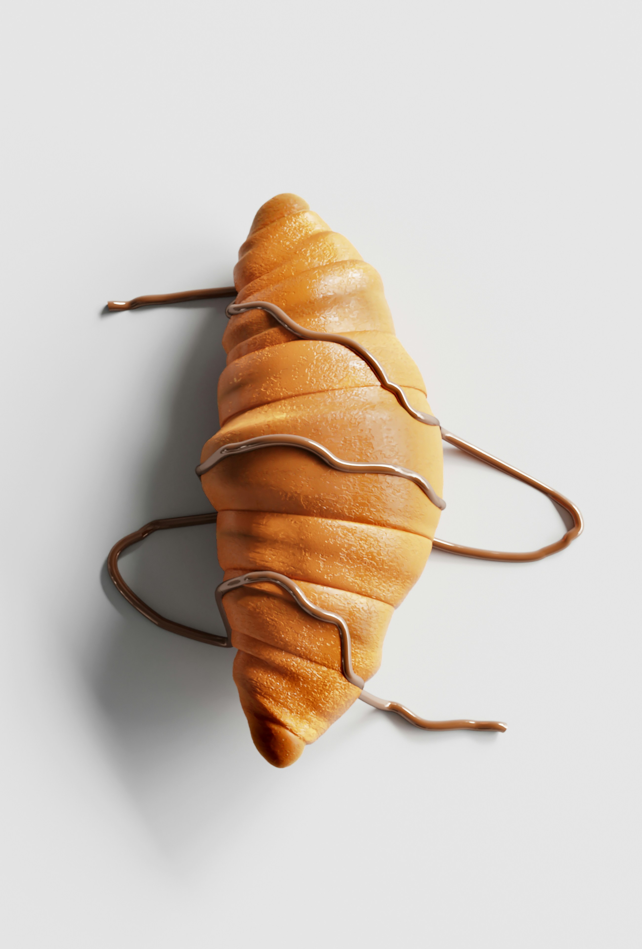 A croissant shaped like a bug on a white surface photo – Free Croissant ...
