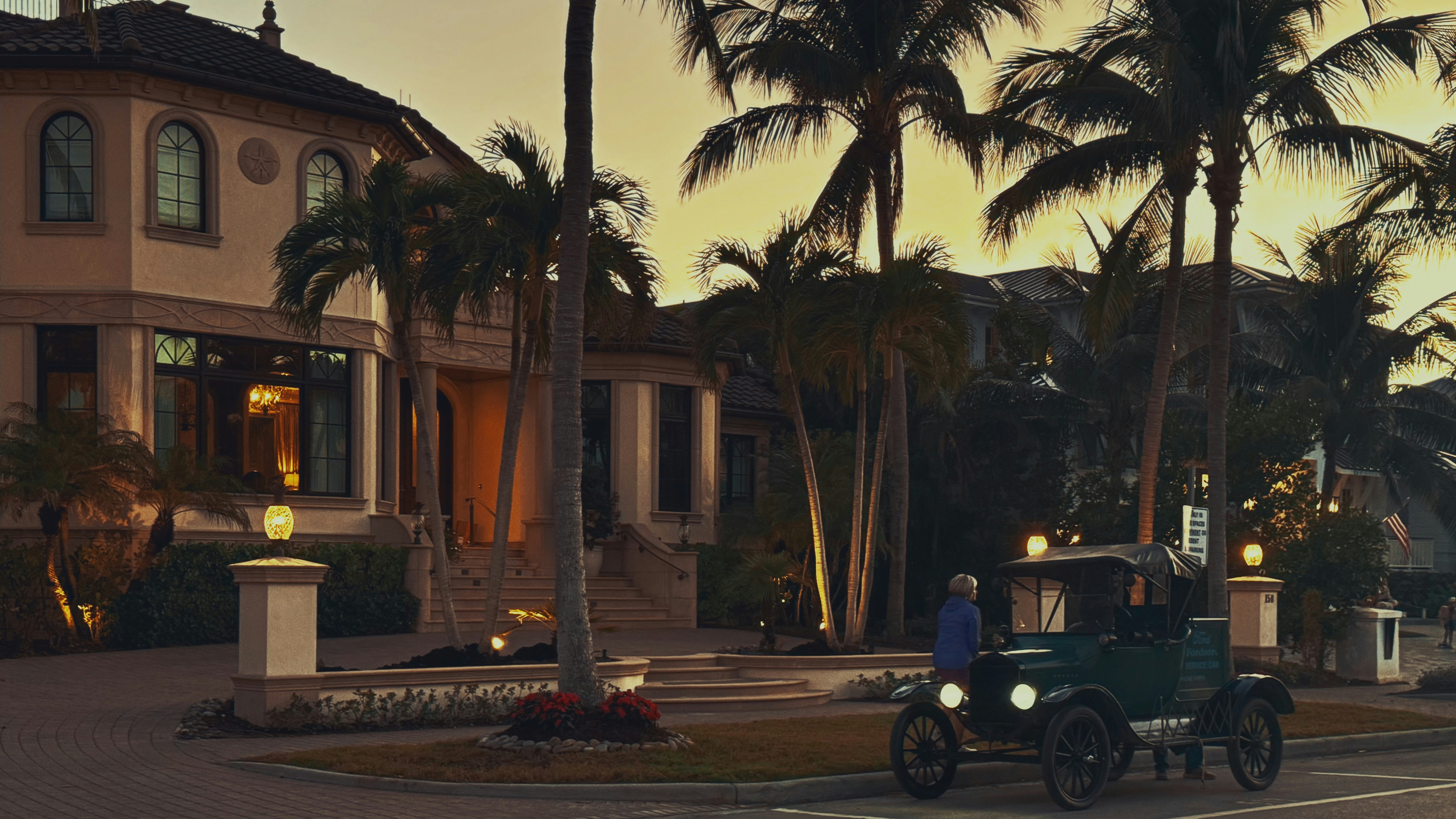 Sunset Palm Drive: A Vintage Open-Top Car by a Mediterranean Villa