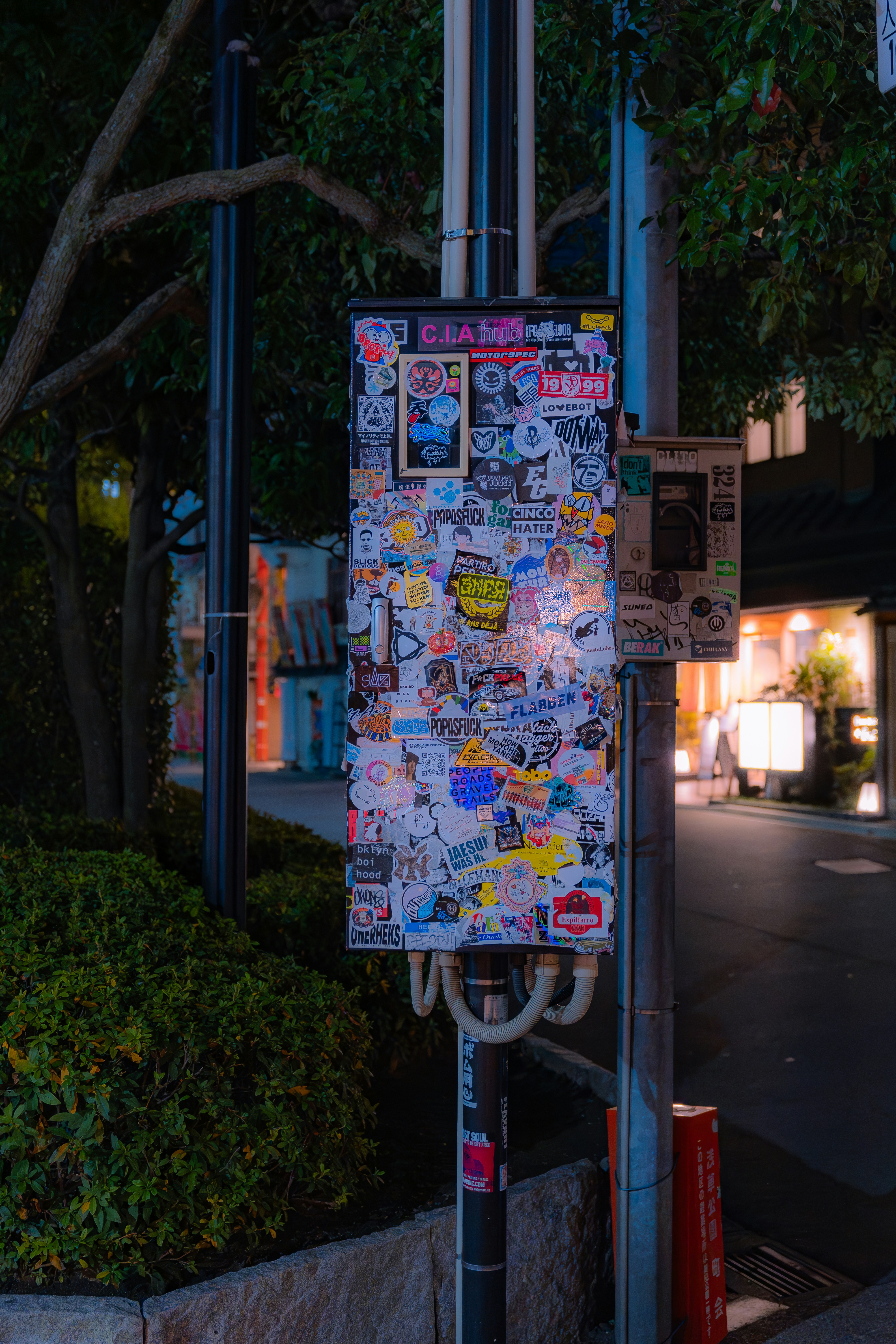 A pole with a bunch of stickers on it photo – Free Tokyo Image on Unsplash