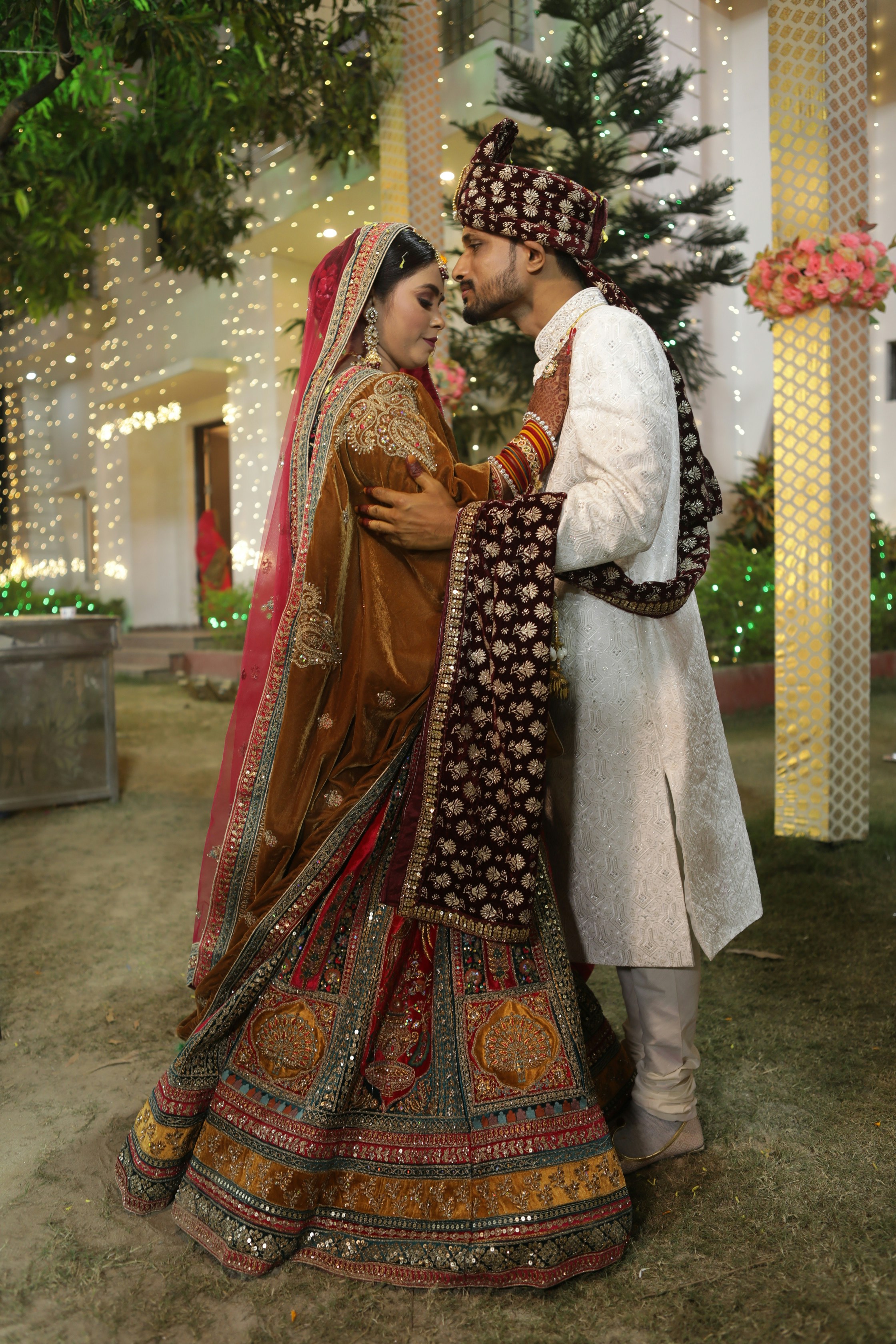 A couple dressed in traditional indian garb posing for a picture photo ...