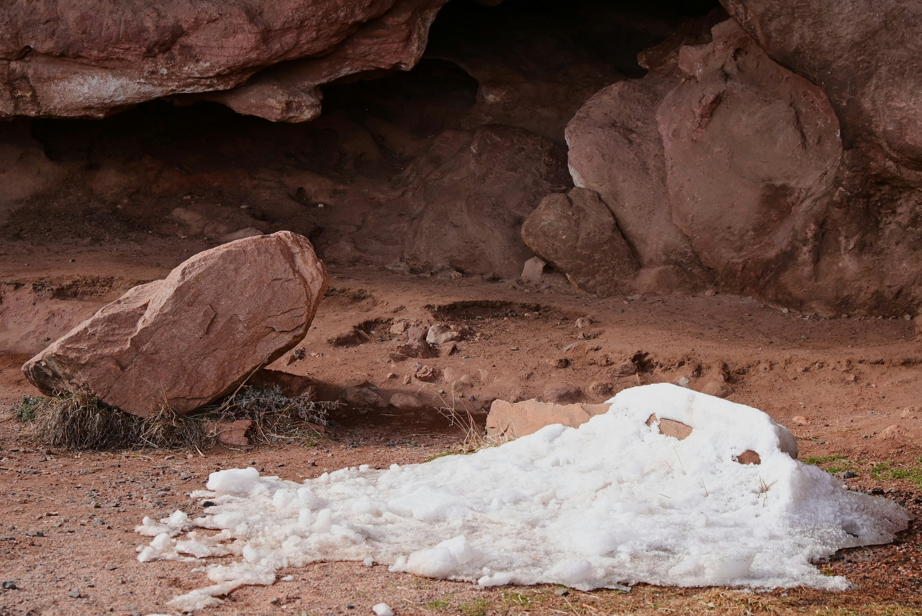 Snow Patch at the Foot of a Red Rock Overhang