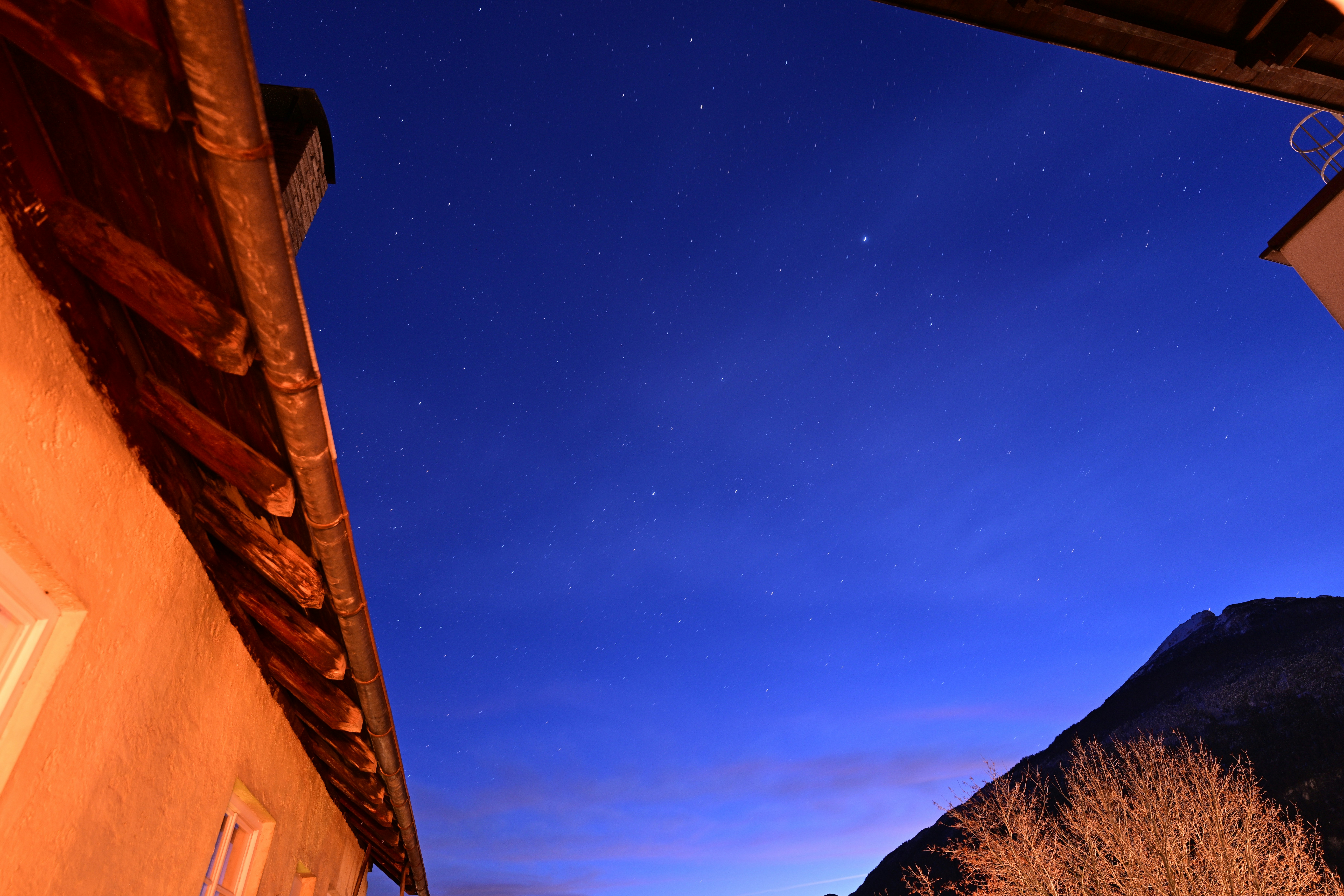 A view of the night sky from the outside of a house photo – Free Nature ...