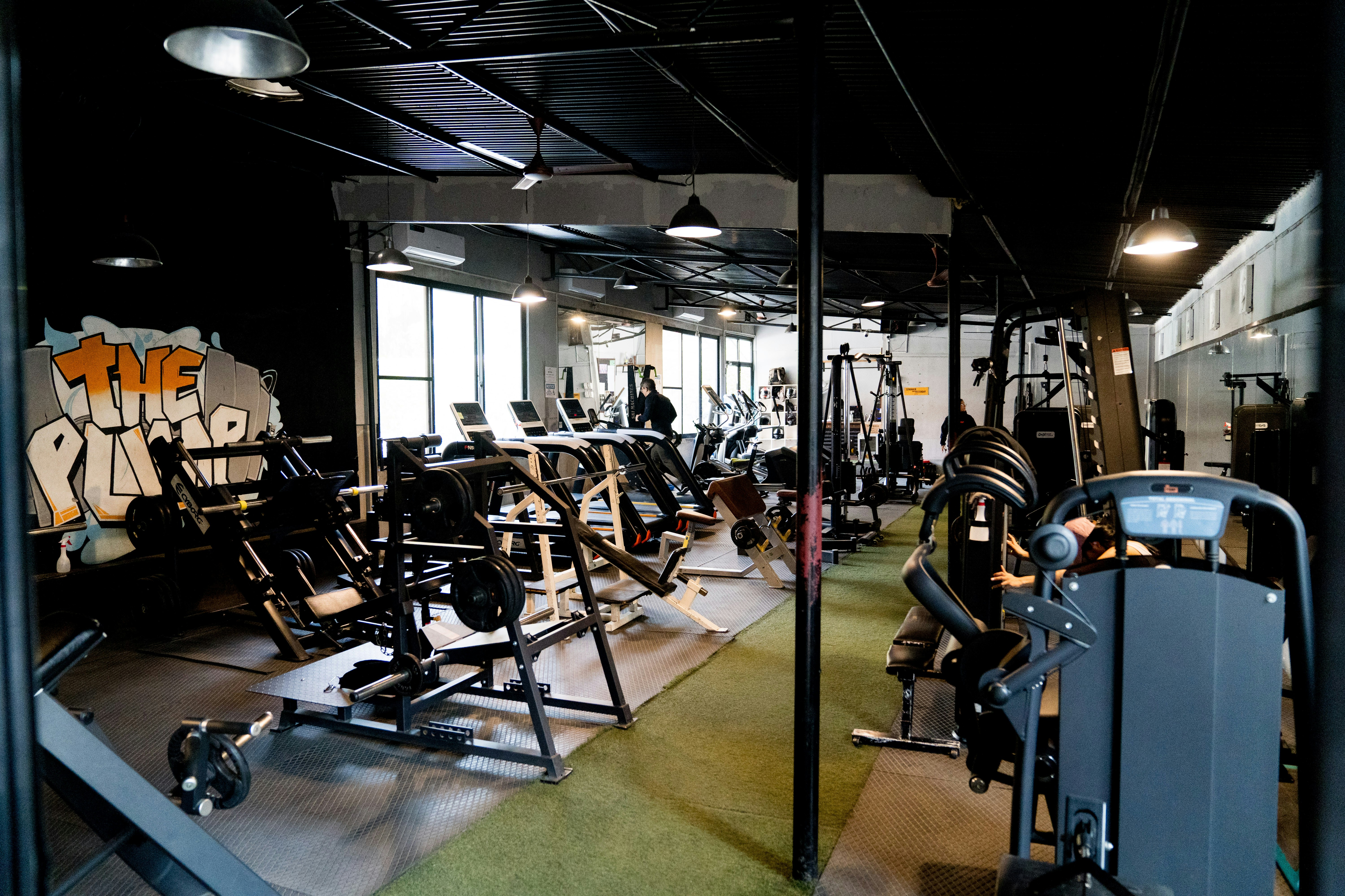 A gym filled with lots of machines and equipment photo – Free Human ...