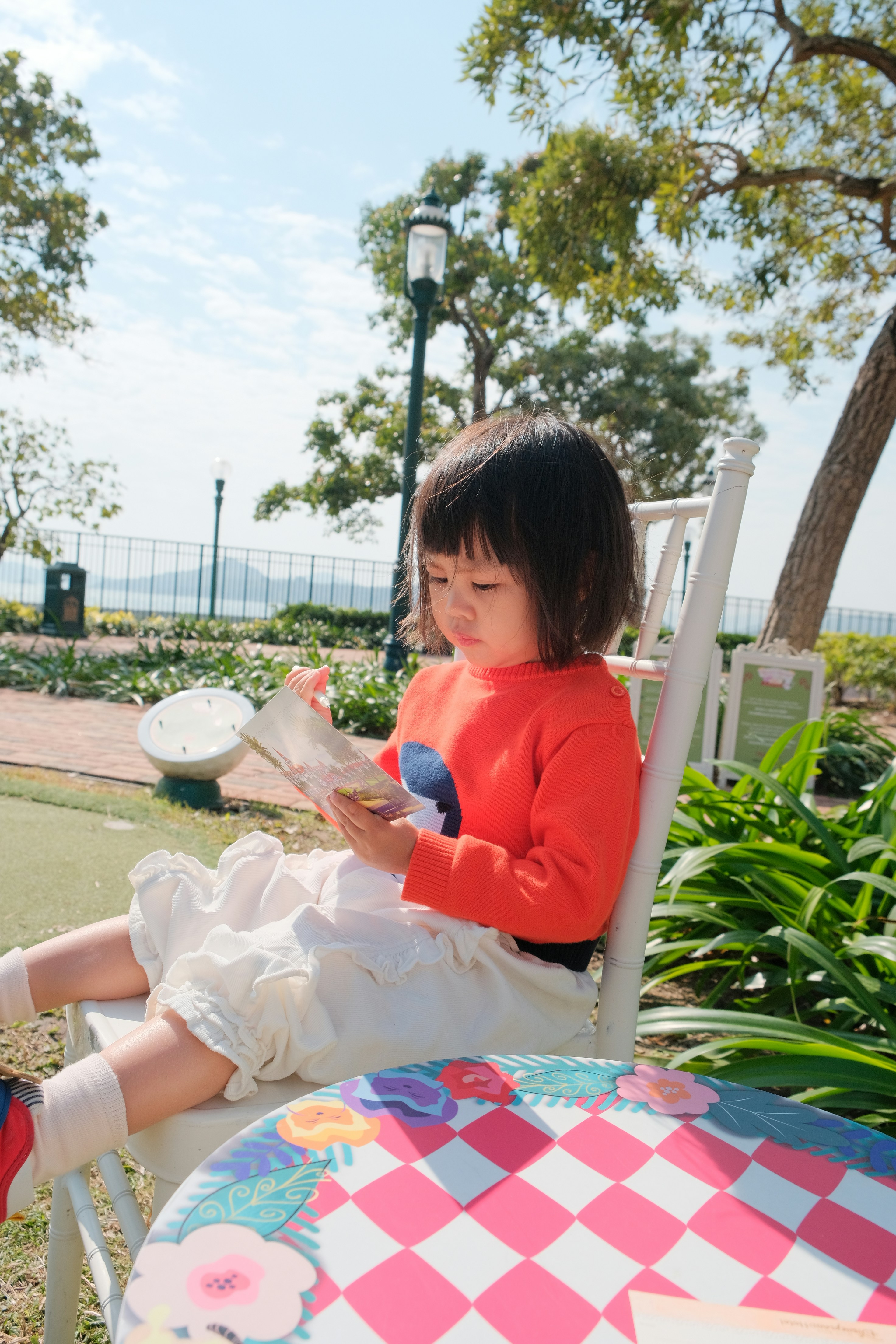 Little Reader in a Sunlit Garden