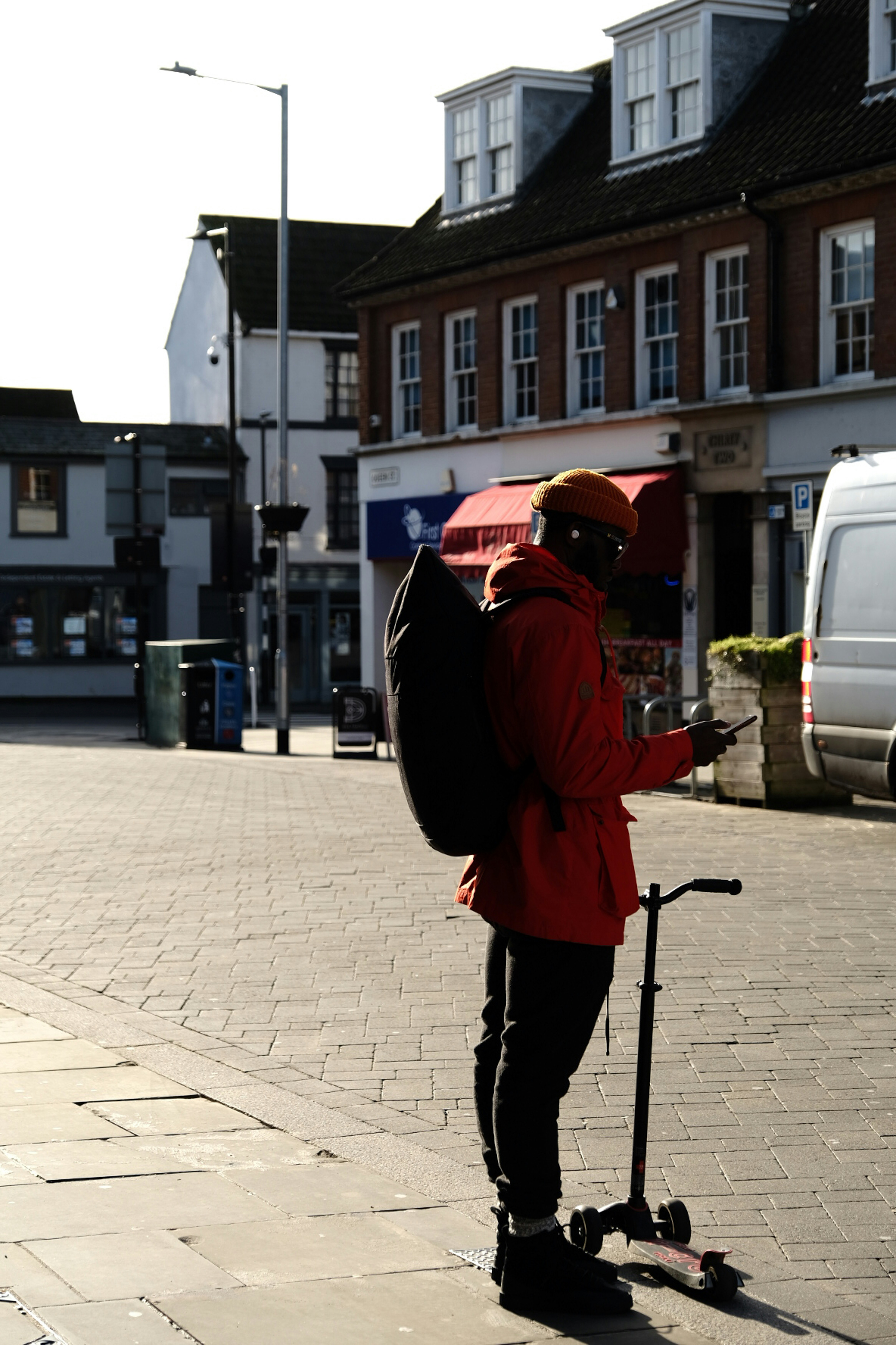 Red Coat in the Quiet Market: A City Street Portrait