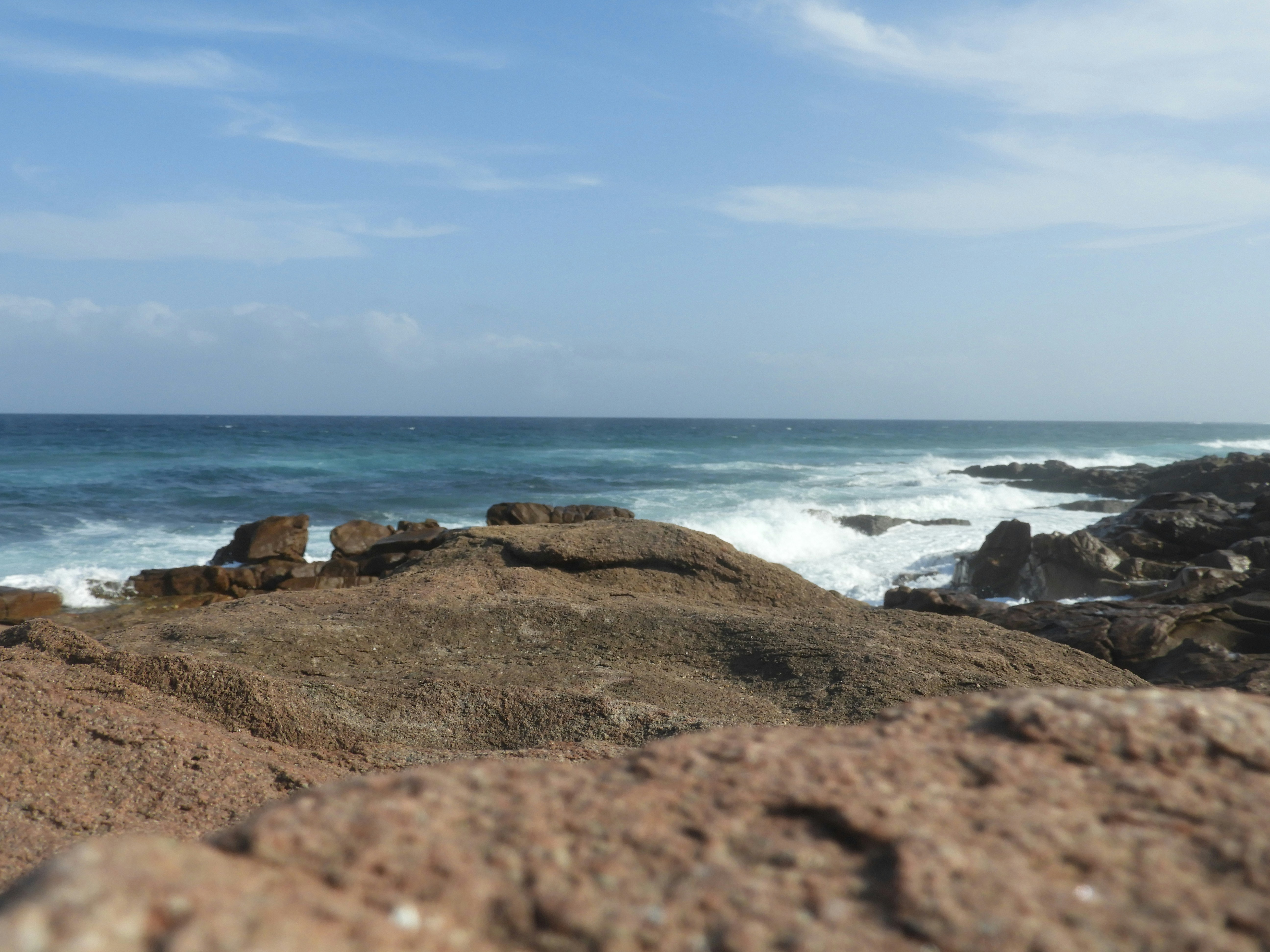 A view of the ocean from a rocky shore photo – Free Park rynie beach ...
