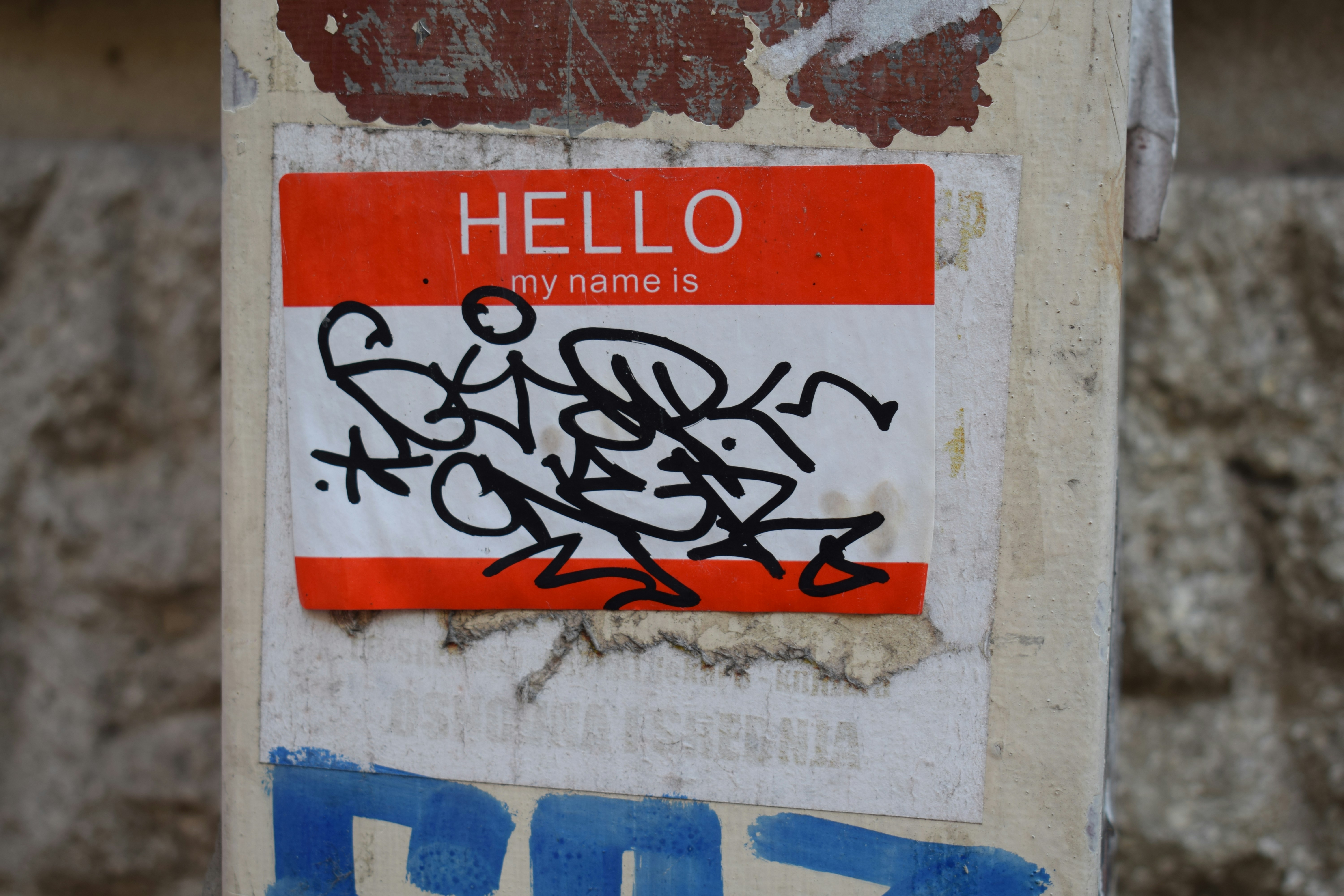 A close up of a street sign with graffiti on it photo – Free Text Image ...