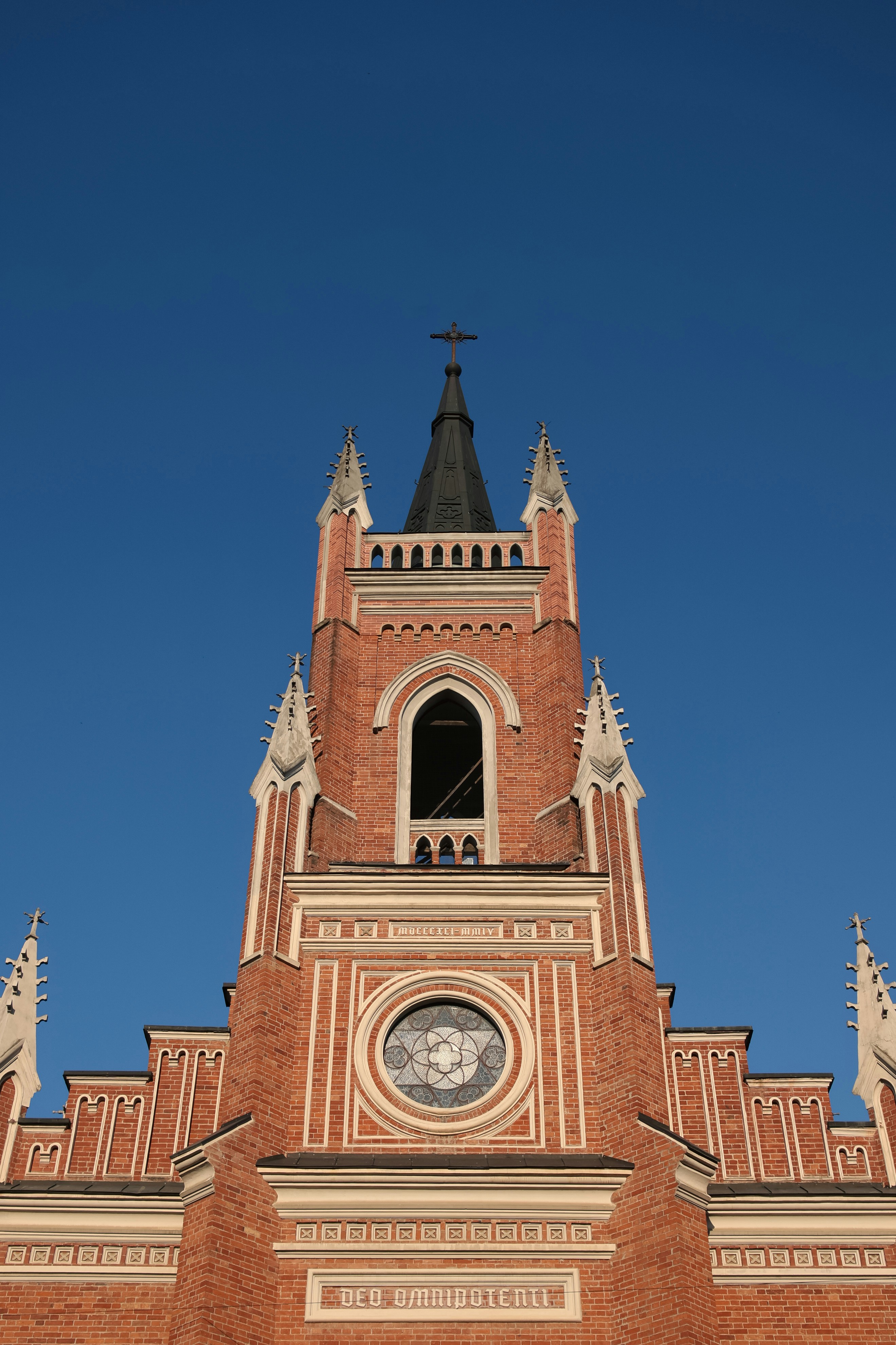 A tall brick building with a clock on it's side photo – Free Kharkiv ...