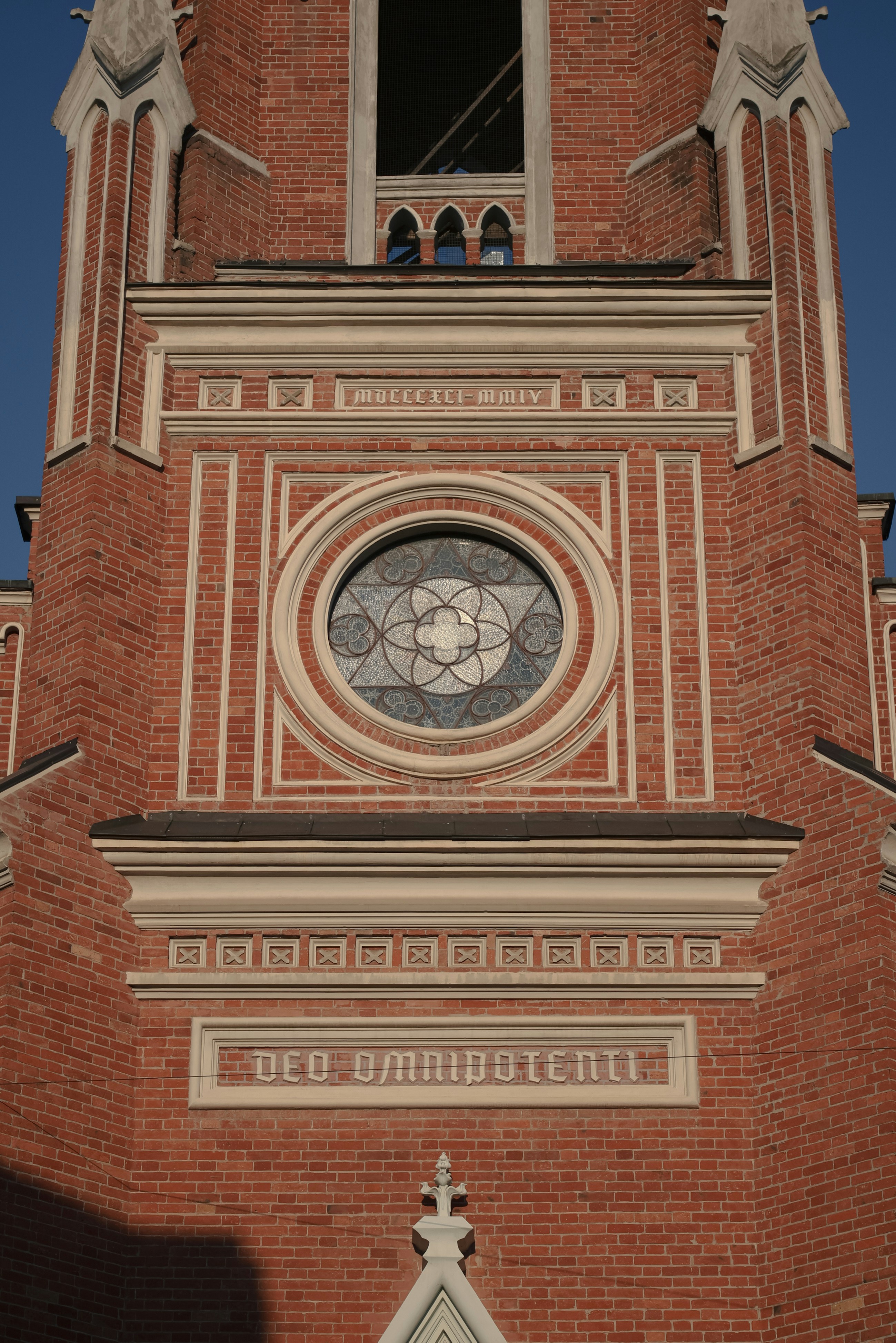 A tall brick building with a clock on it's side photo – Free Kharkiv ...