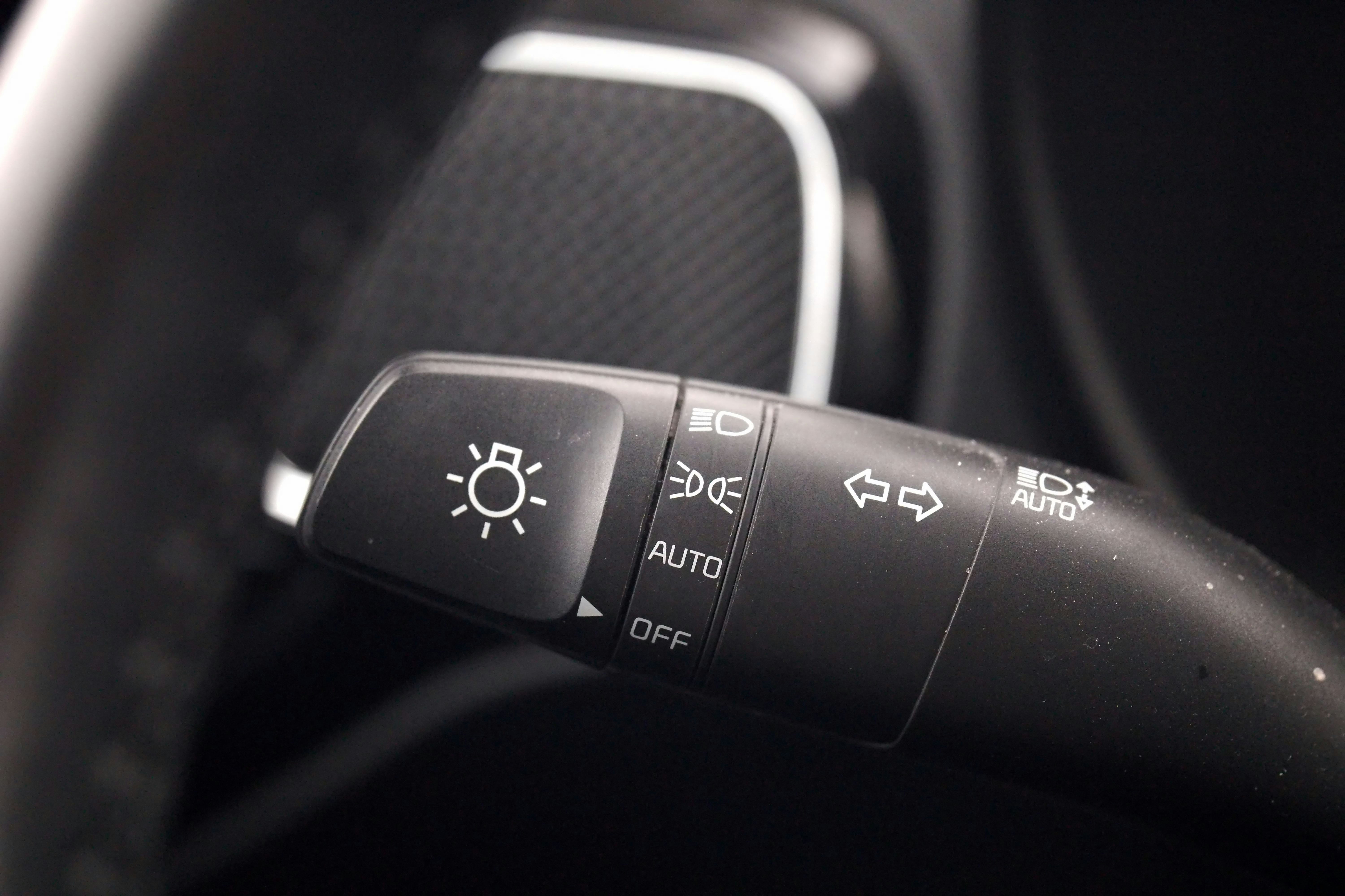 A close up of a steering wheel with buttons photo – Free Véhicule Image ...