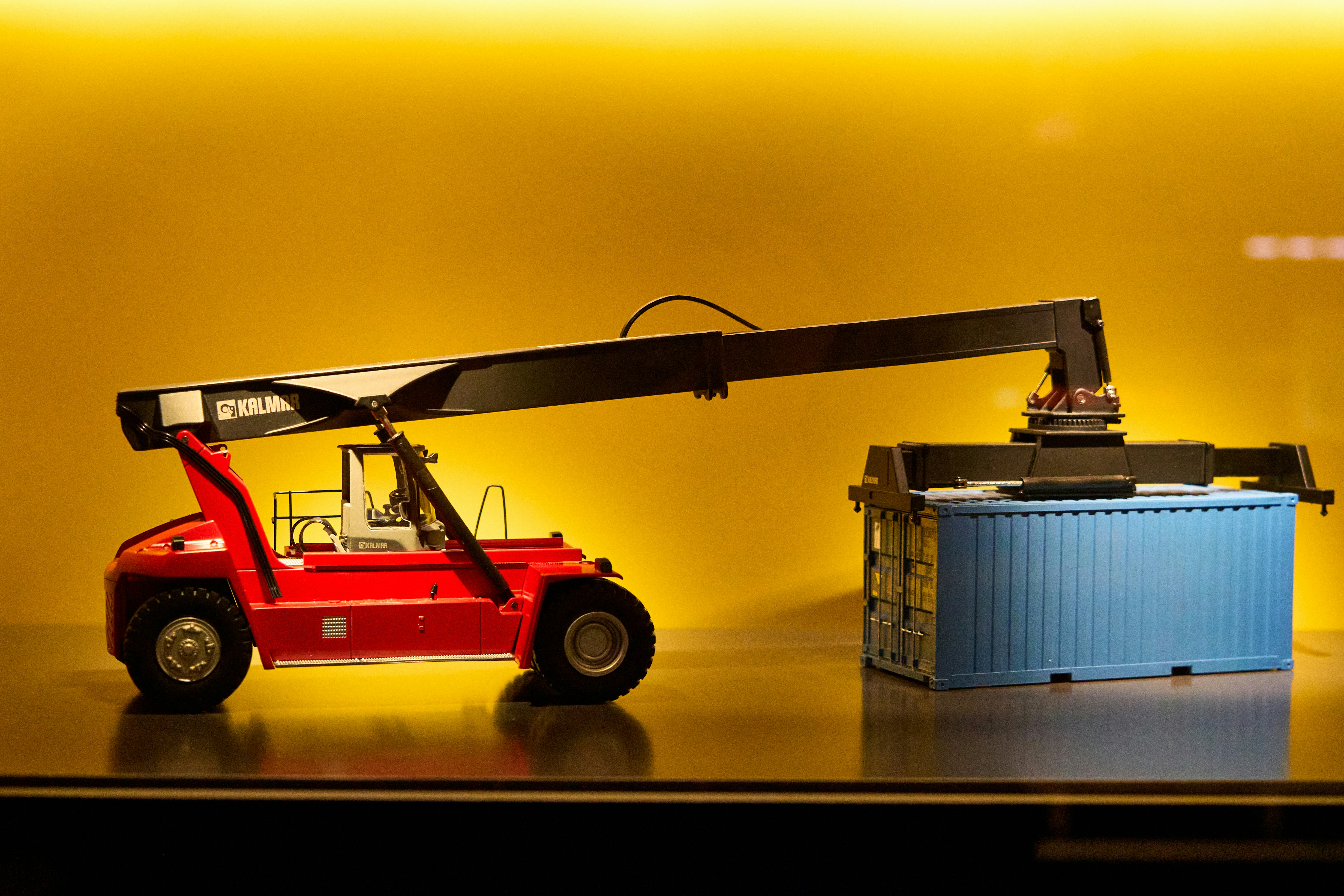 Crane-on-wheels: miniature lift in a golden workshop