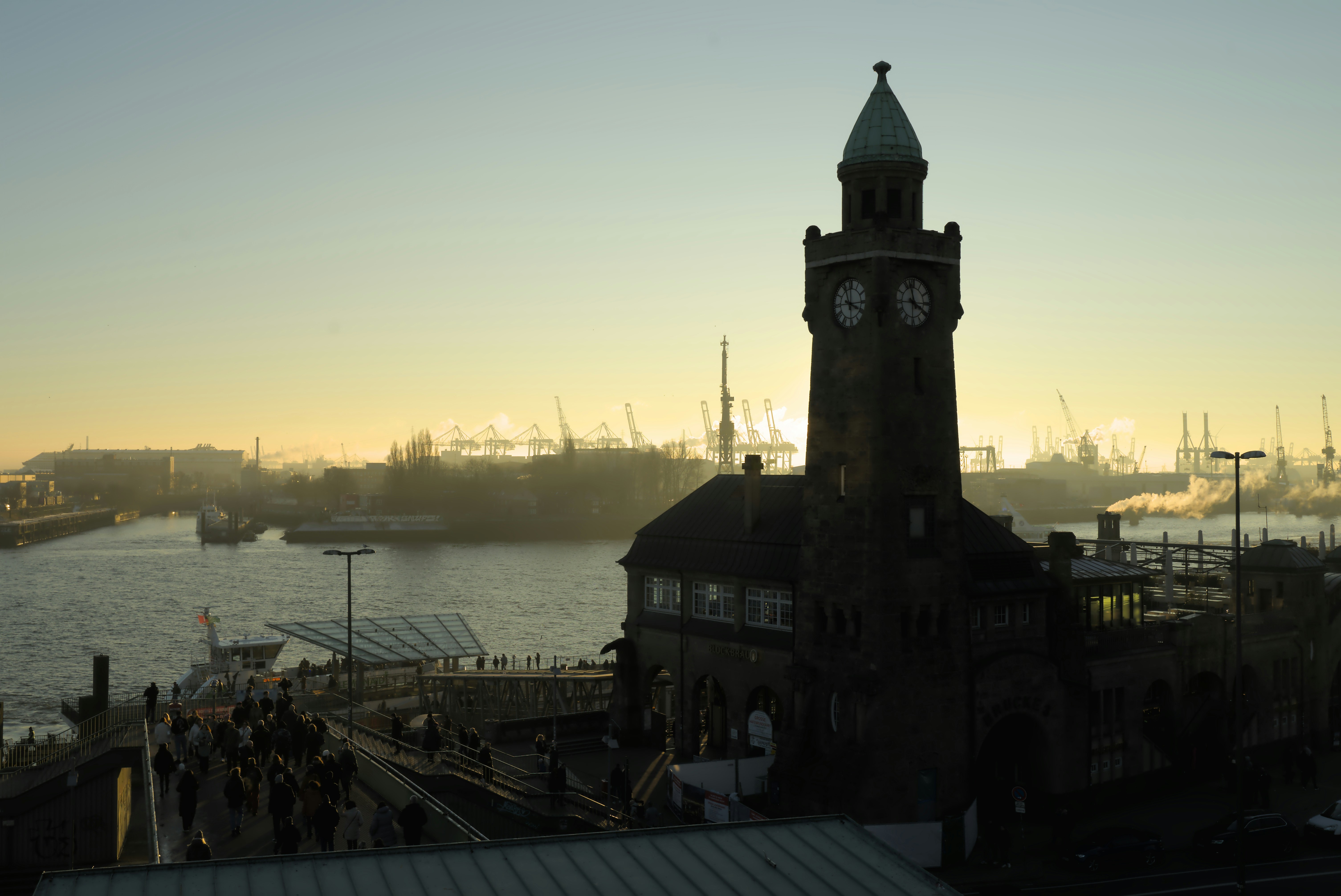 Harbor Twilight: Clocktower silhouette over the moored docks