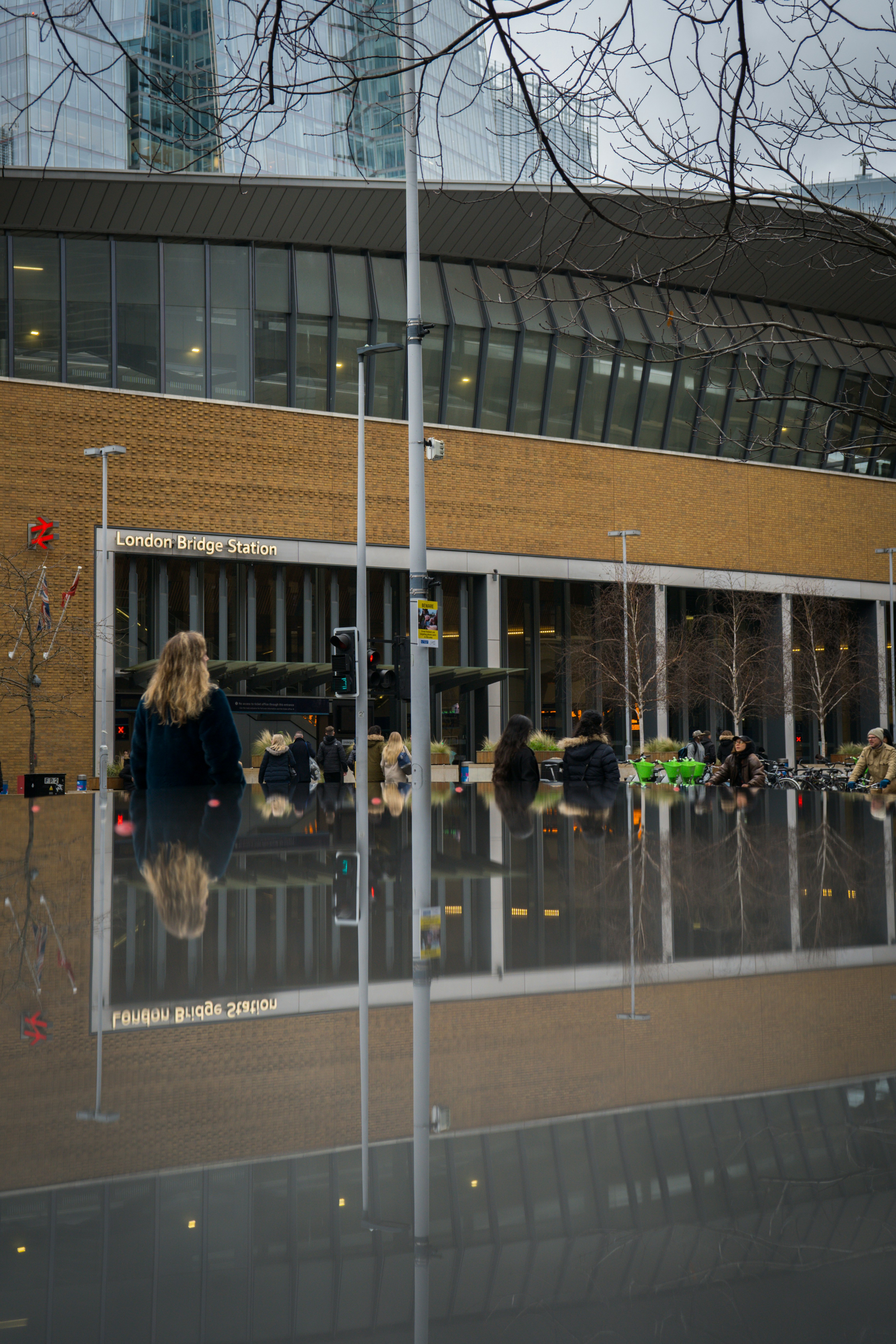 A group of people standing outside of a building photo – Free Building ...