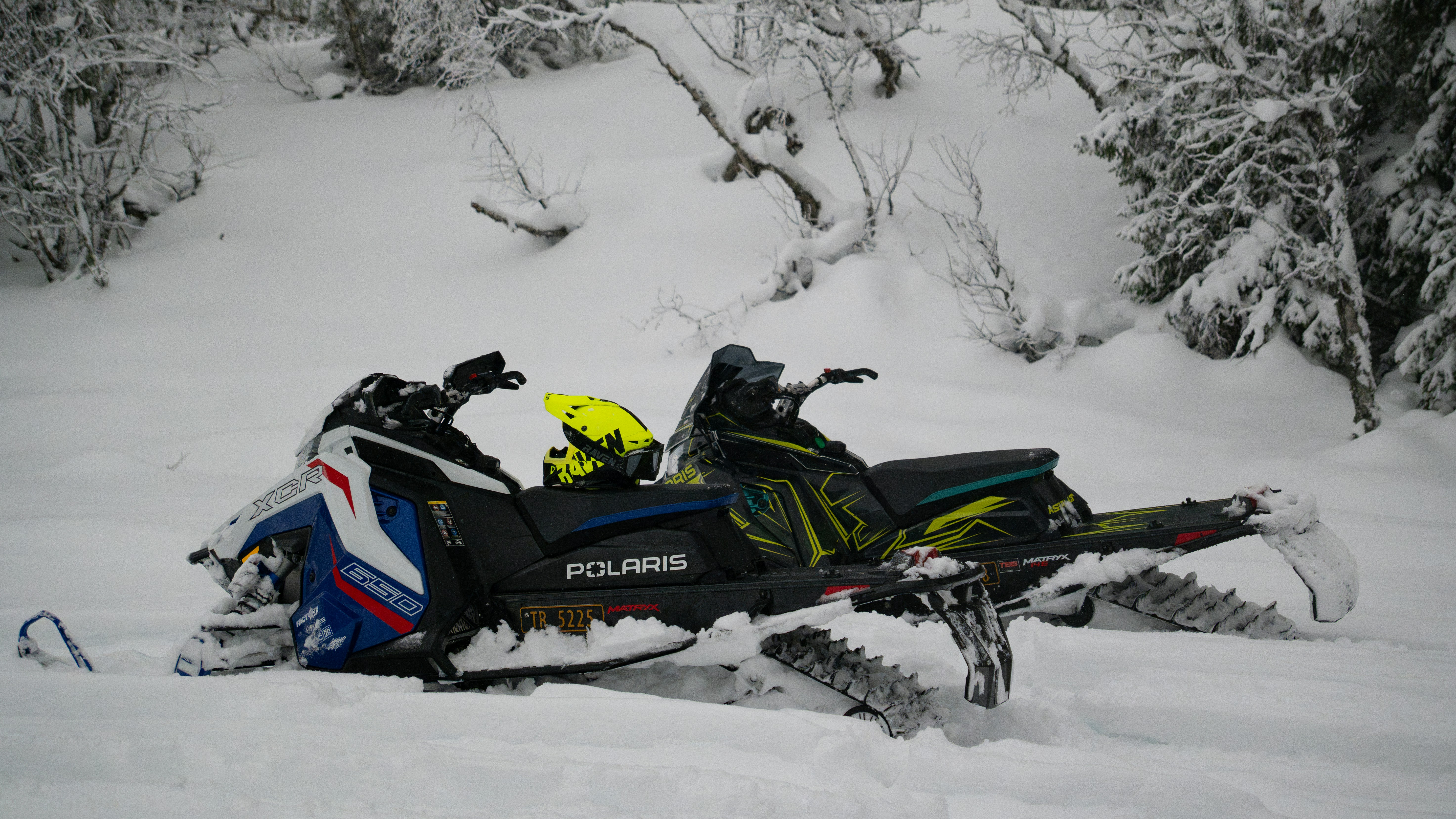 A person riding a snowmobile in the snow photo – Free Human Image on ...