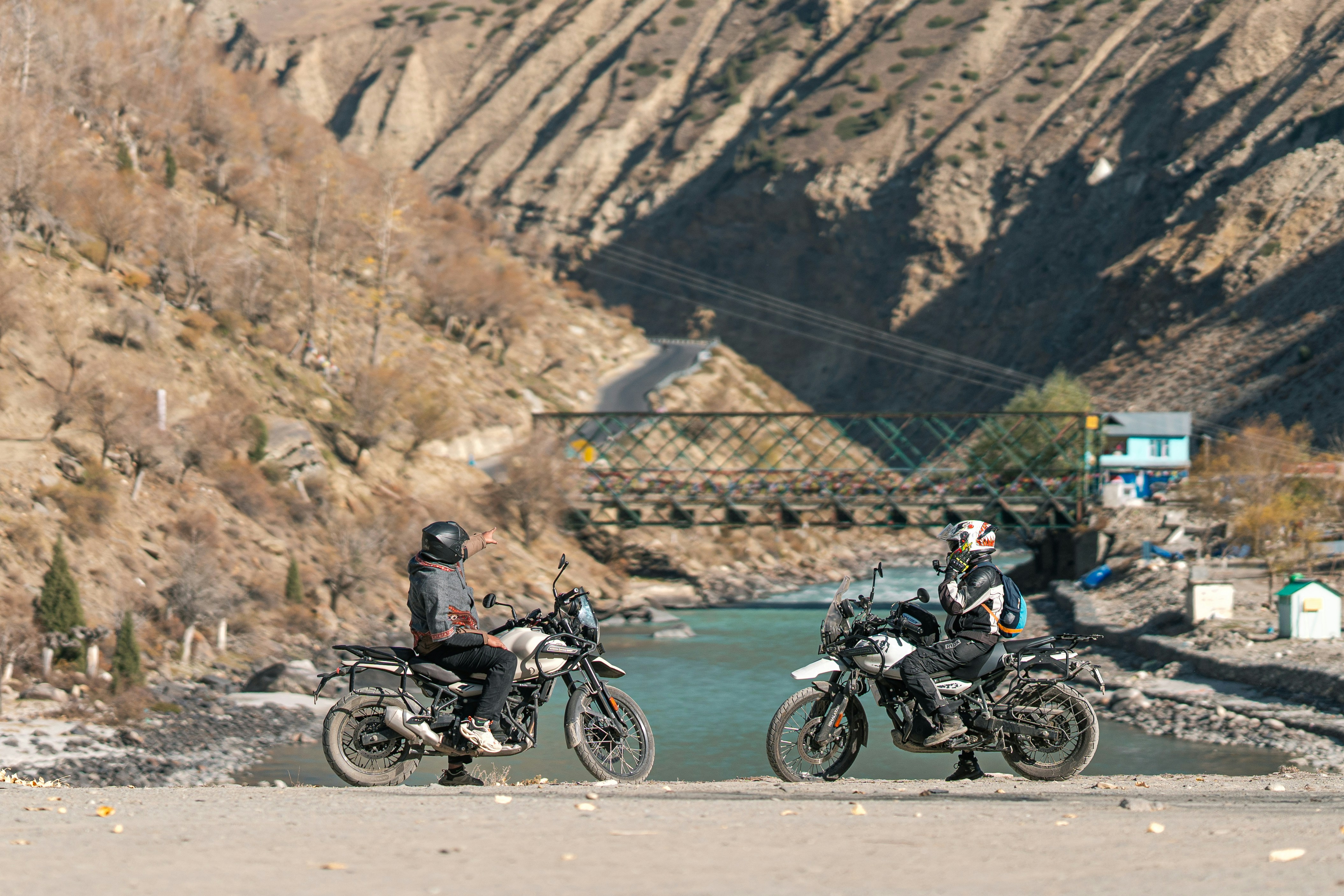 A group of motorcycles parked next to a river photo – Free India Image ...