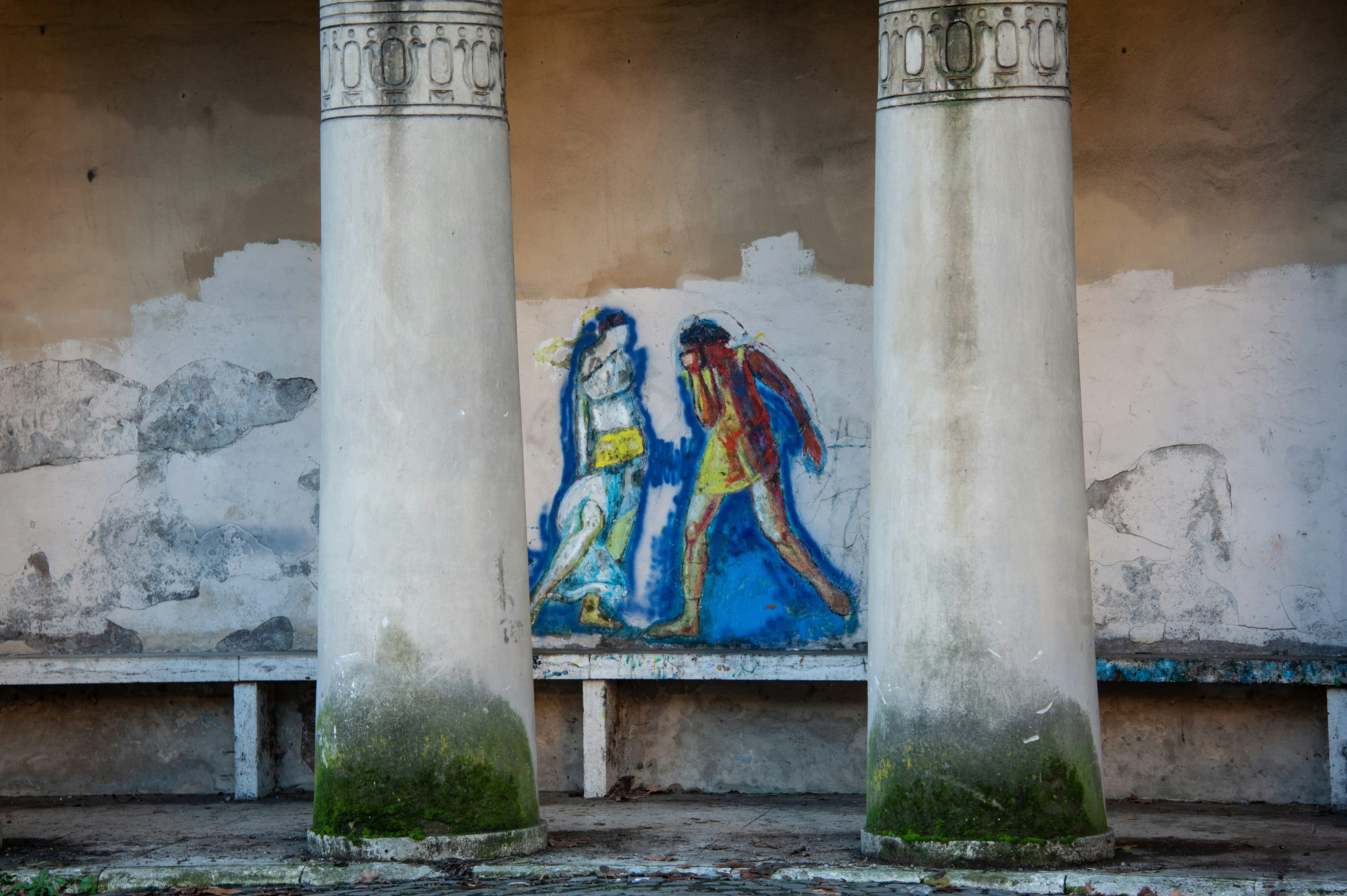 Mural Chronicles Between Timeworn Pillars