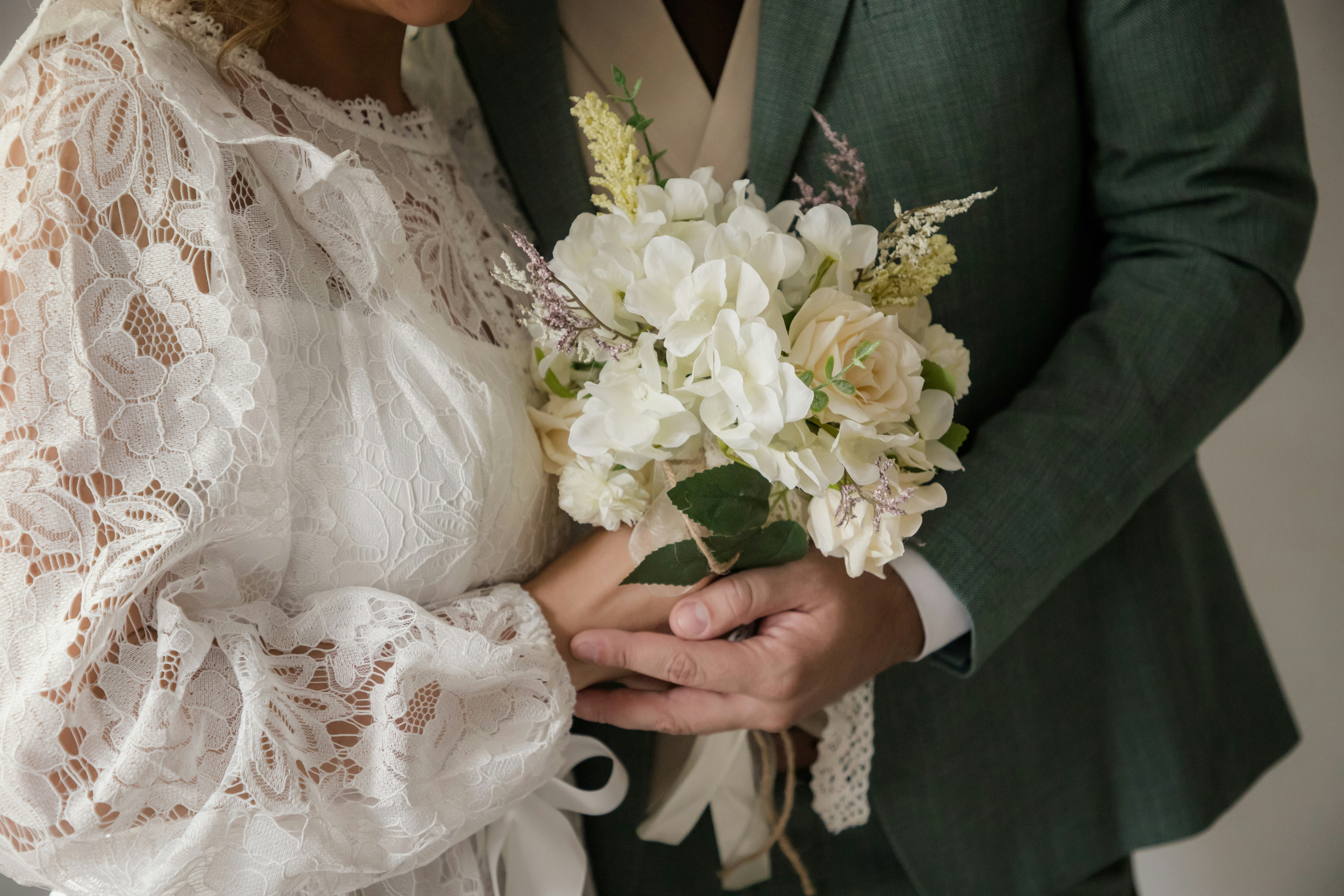 A bride and groom pose for a picture photo – Free Wedding Image on Unsplash