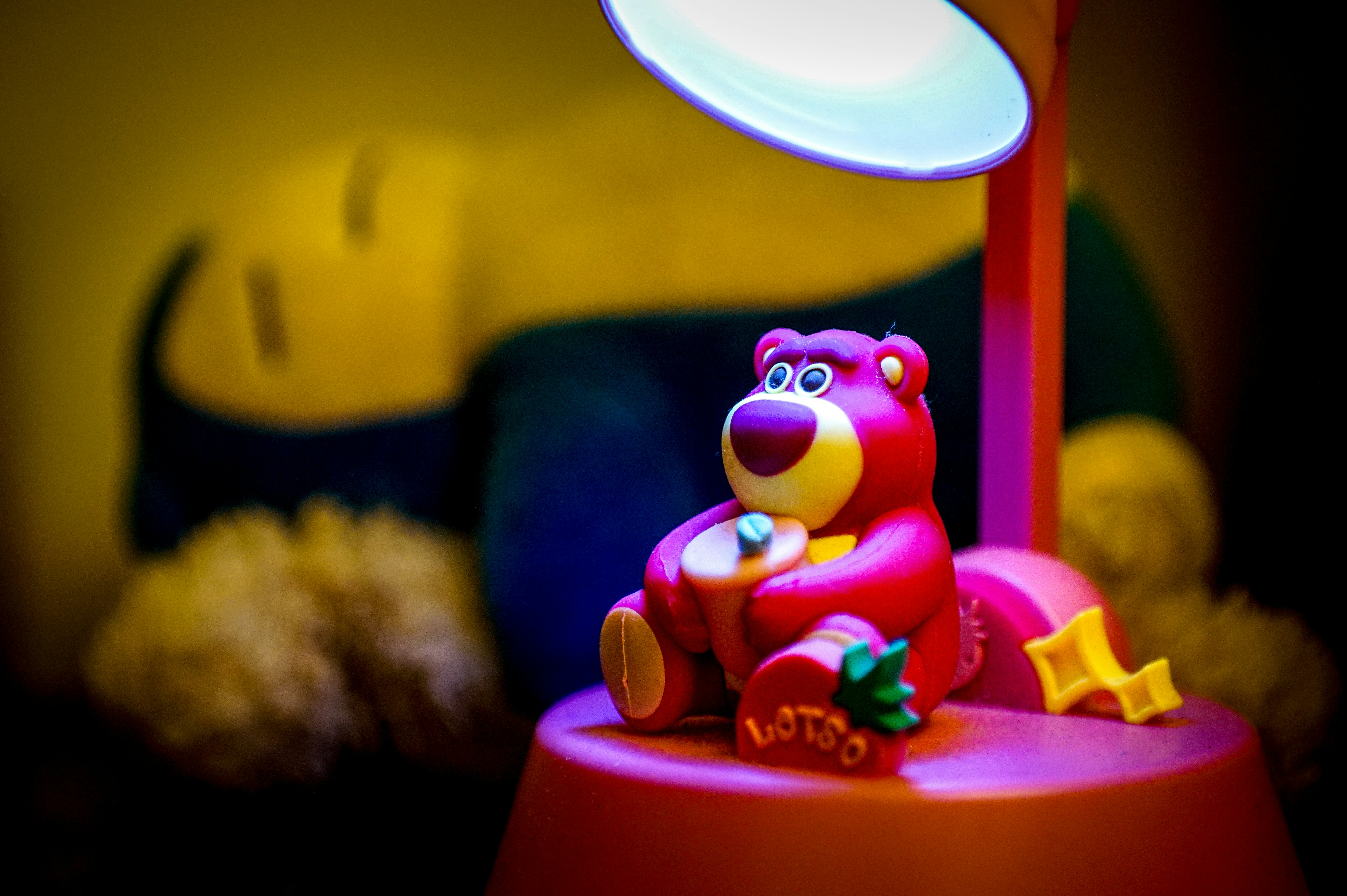 Playful Pink Bear Under a Neon Lamp