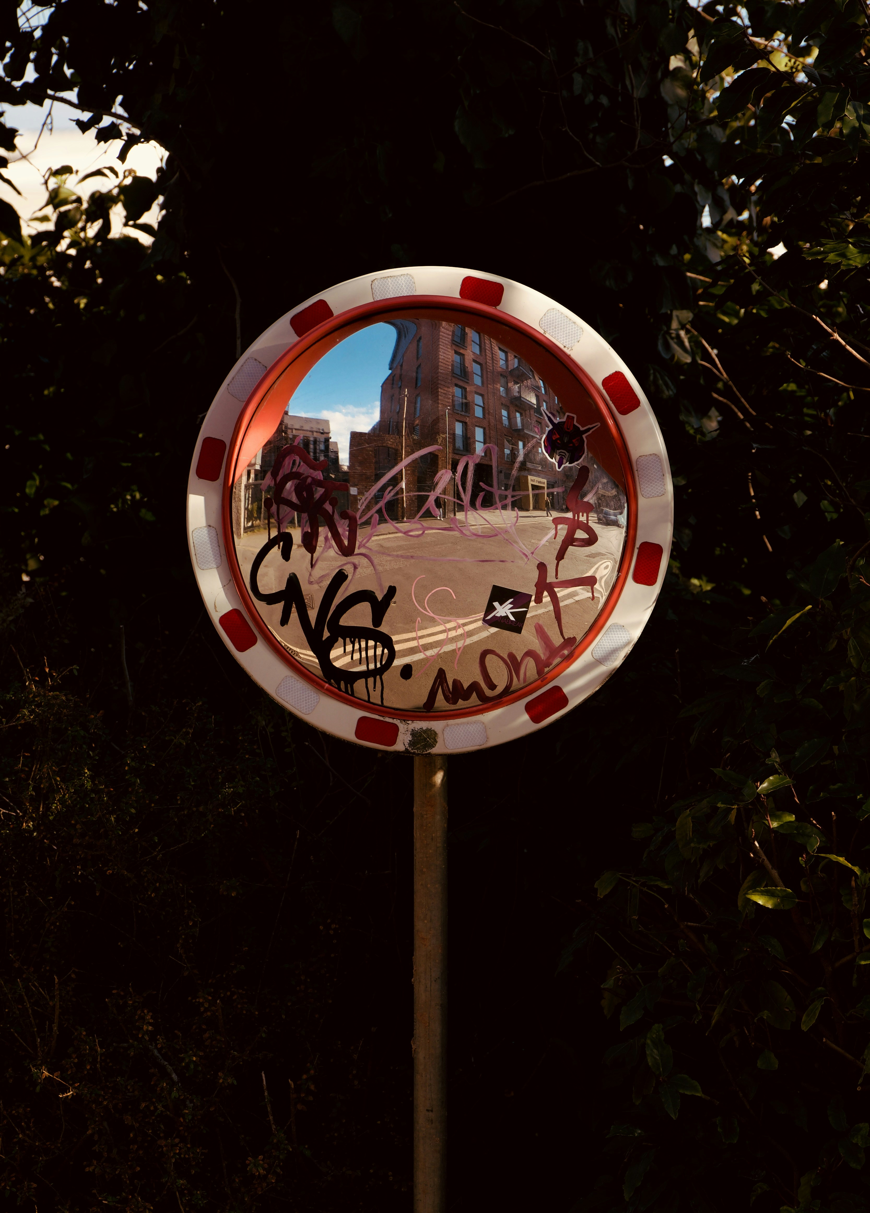 A street sign with graffiti written on it photo – Free Background Image ...