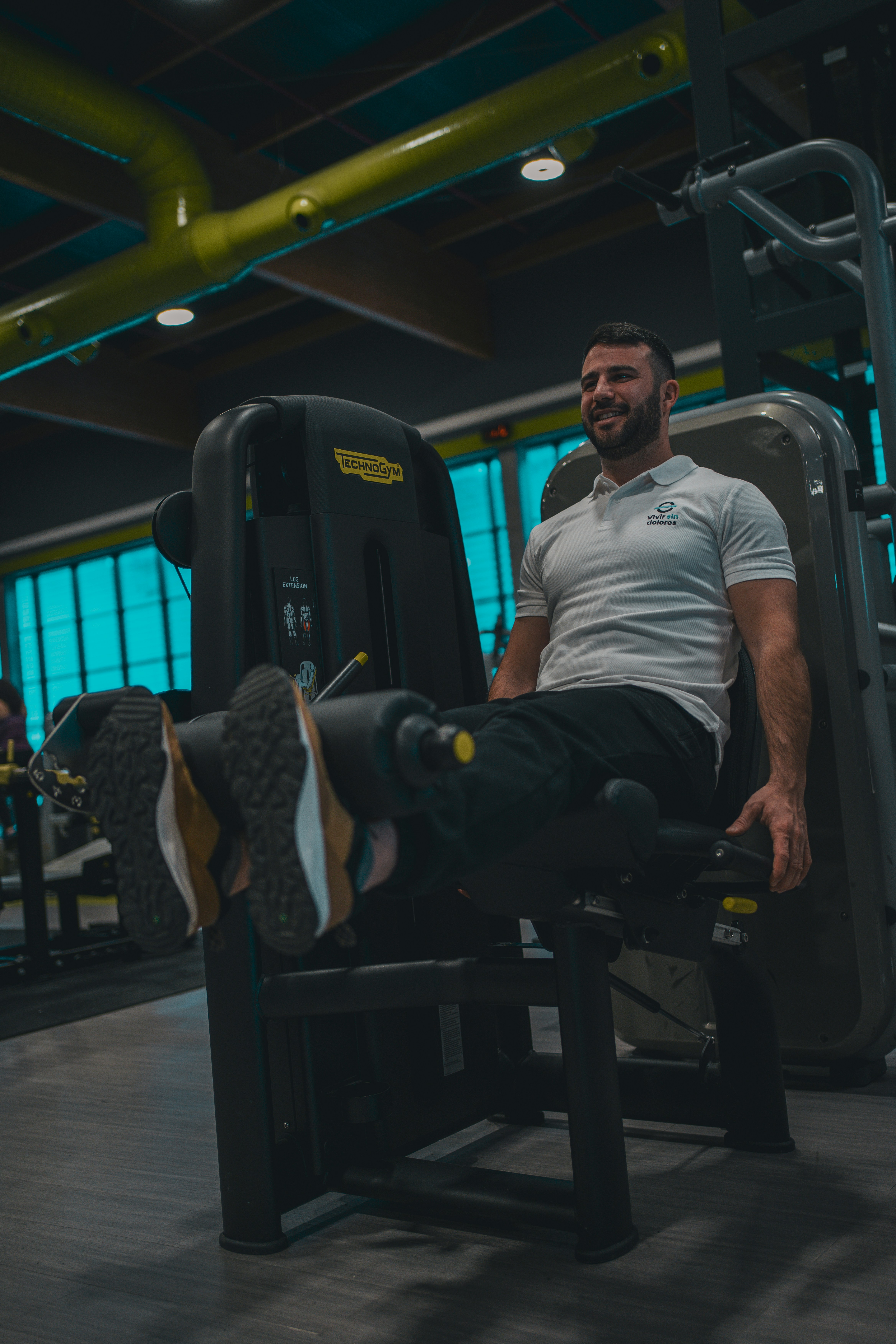 A man sitting on a bench in a gym photo – Free Stronger every day Image ...