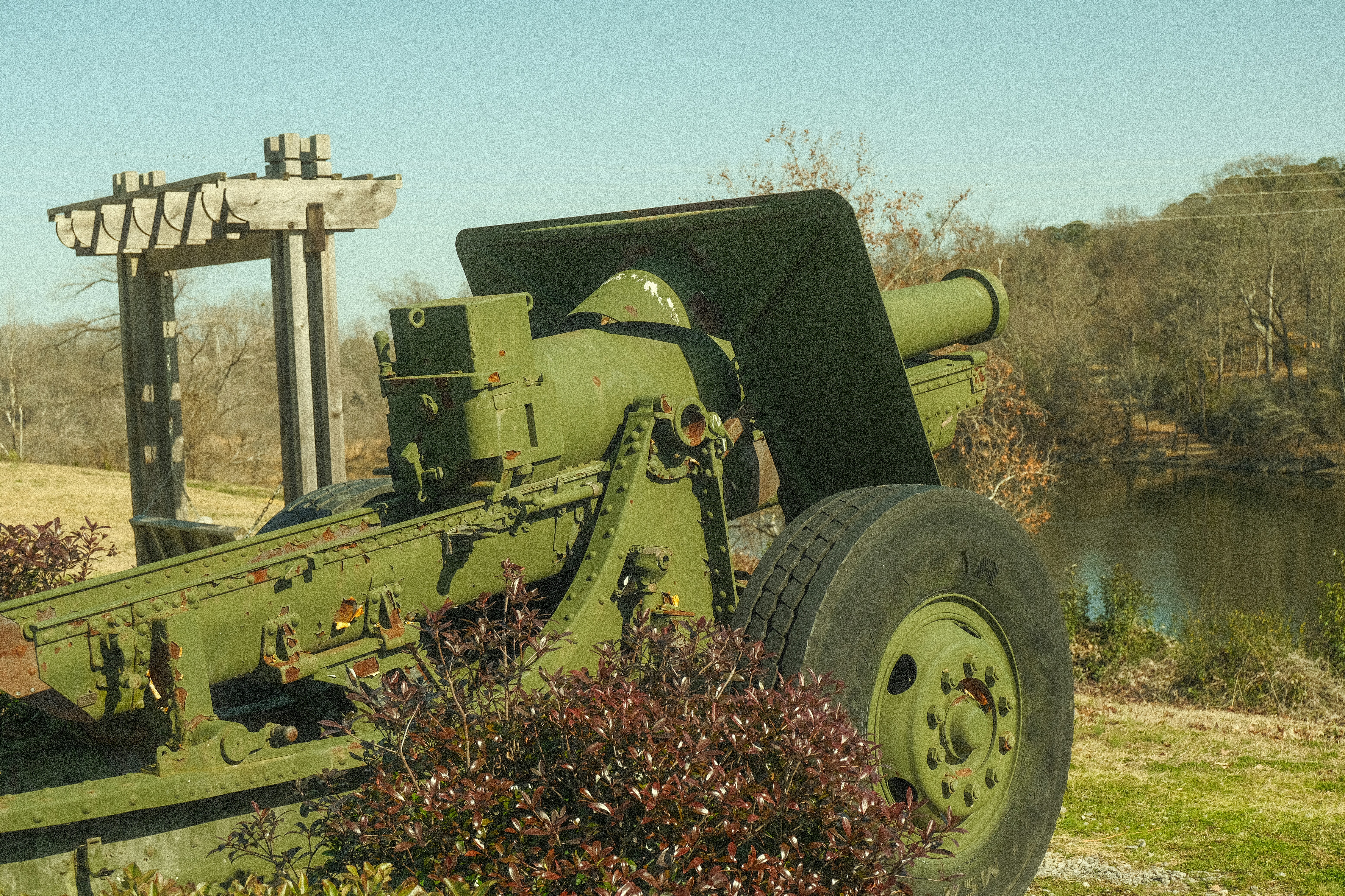 Verdant Field Gun by the Riverside in Afternoon Light
